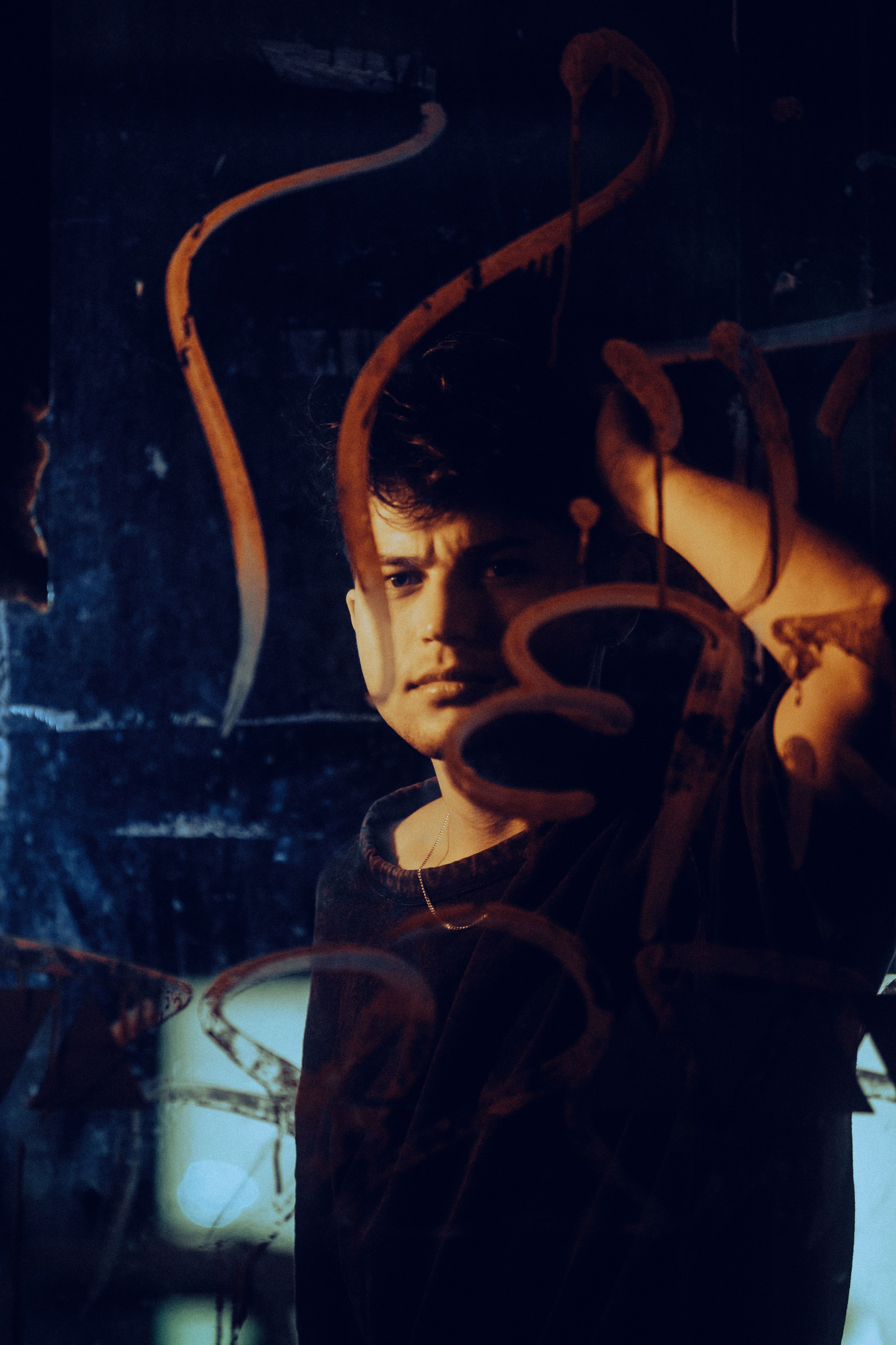 Man Standing behind Painted Window · Free Stock Photo