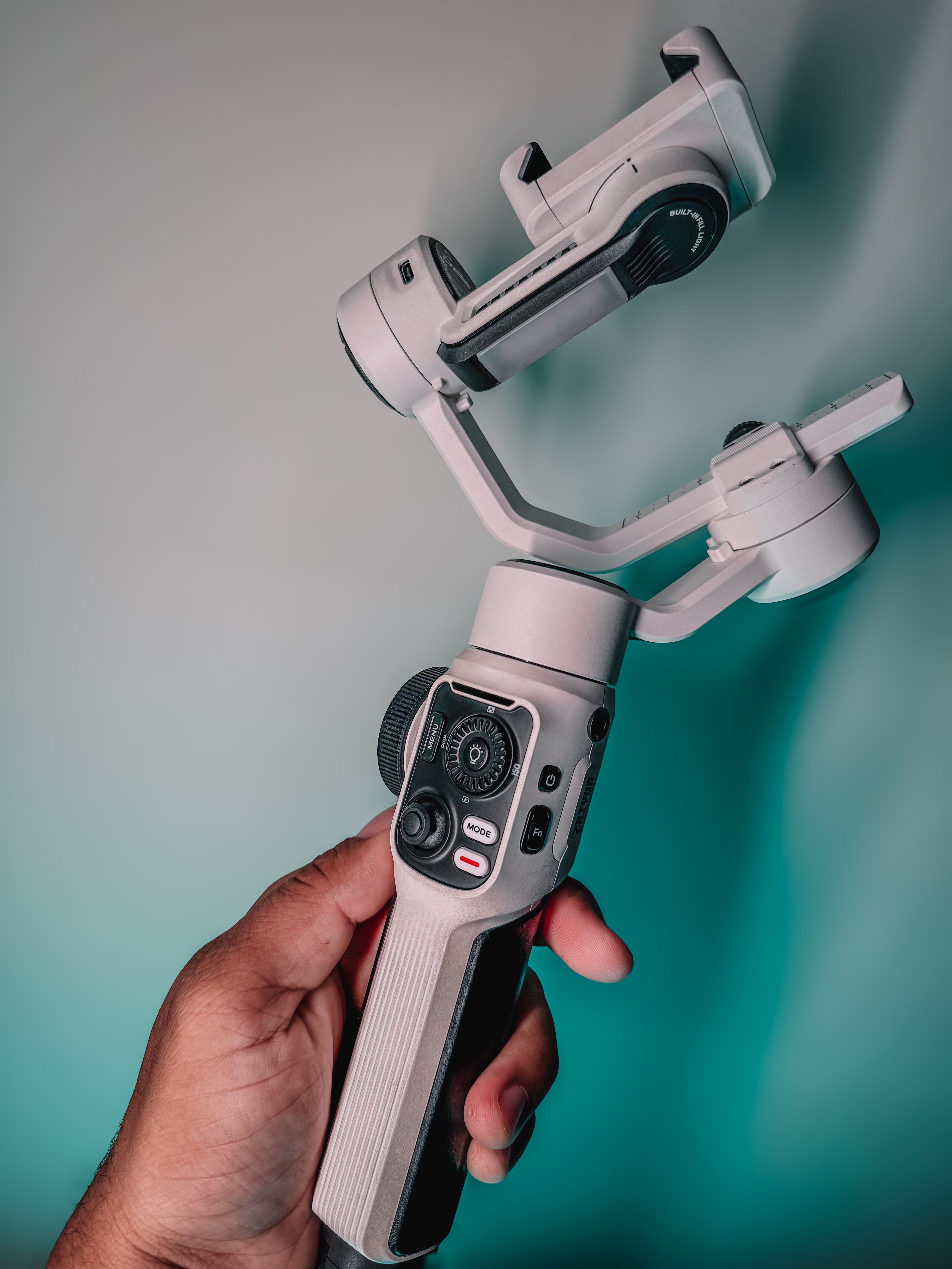 White cell phone stabilizer. · Free Stock Photo