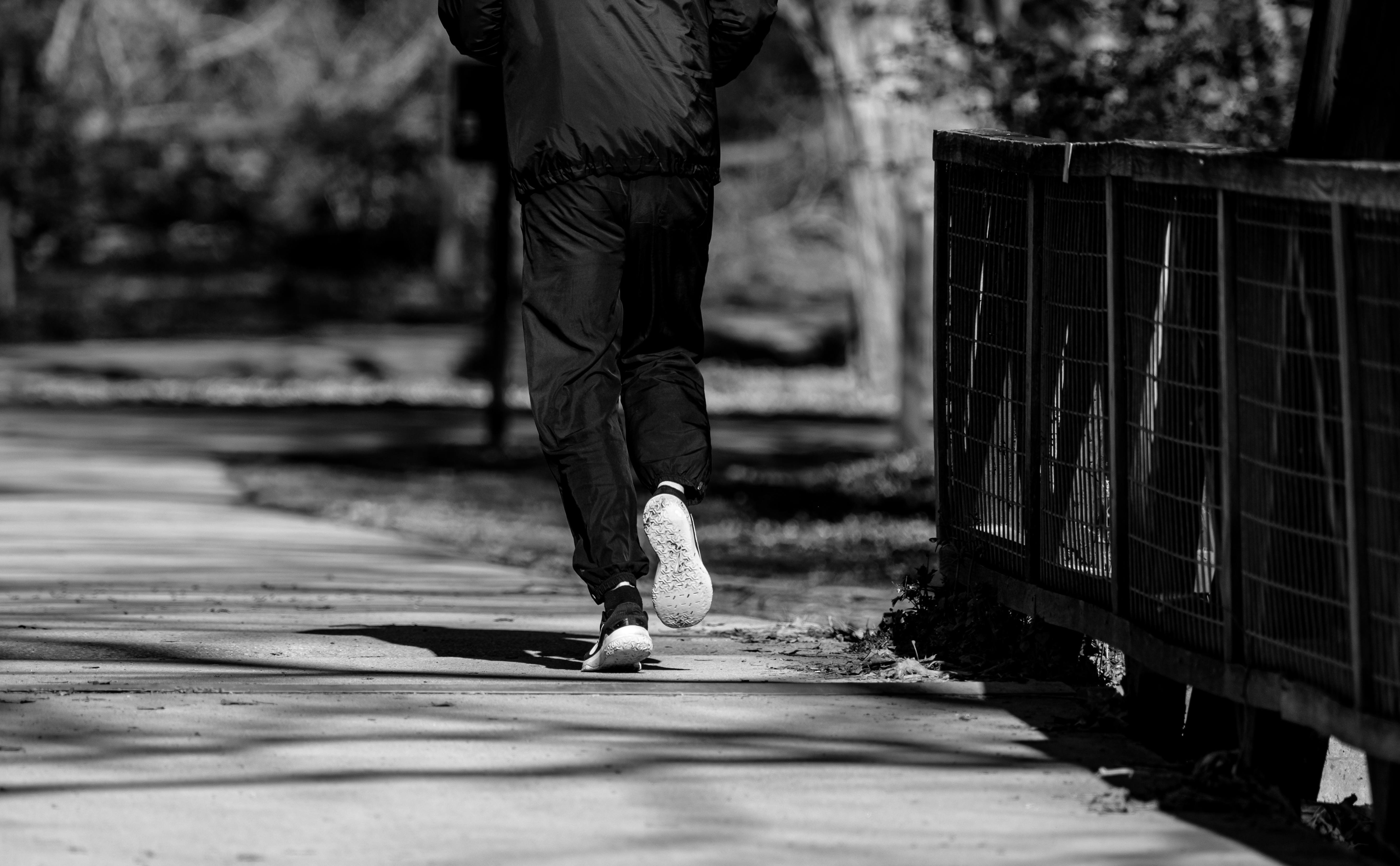 Back View of a Man Running in a Park · Free Stock Photo