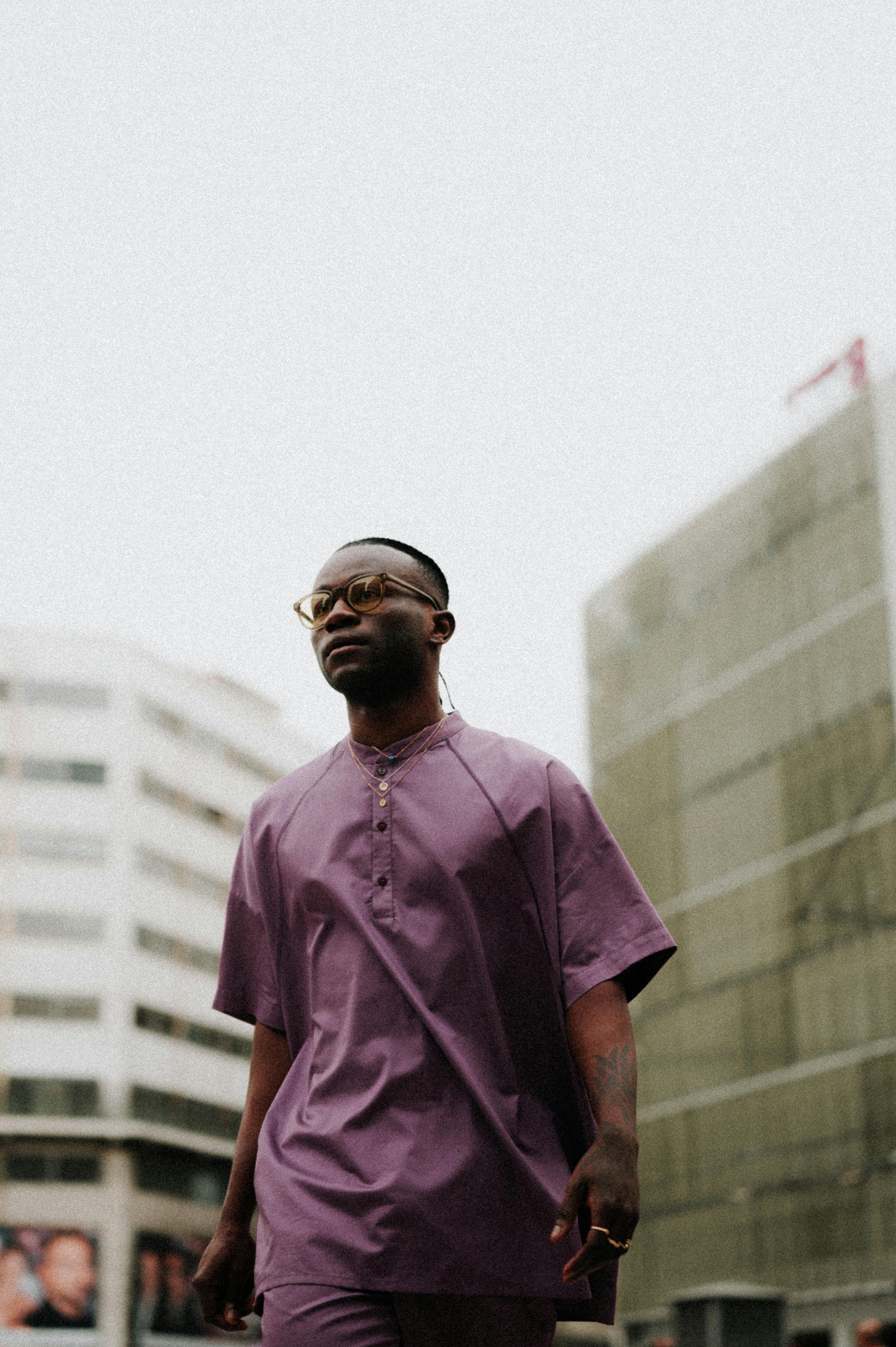 African Man Wearing Pink Shirt on a Street · Free Stock Photo