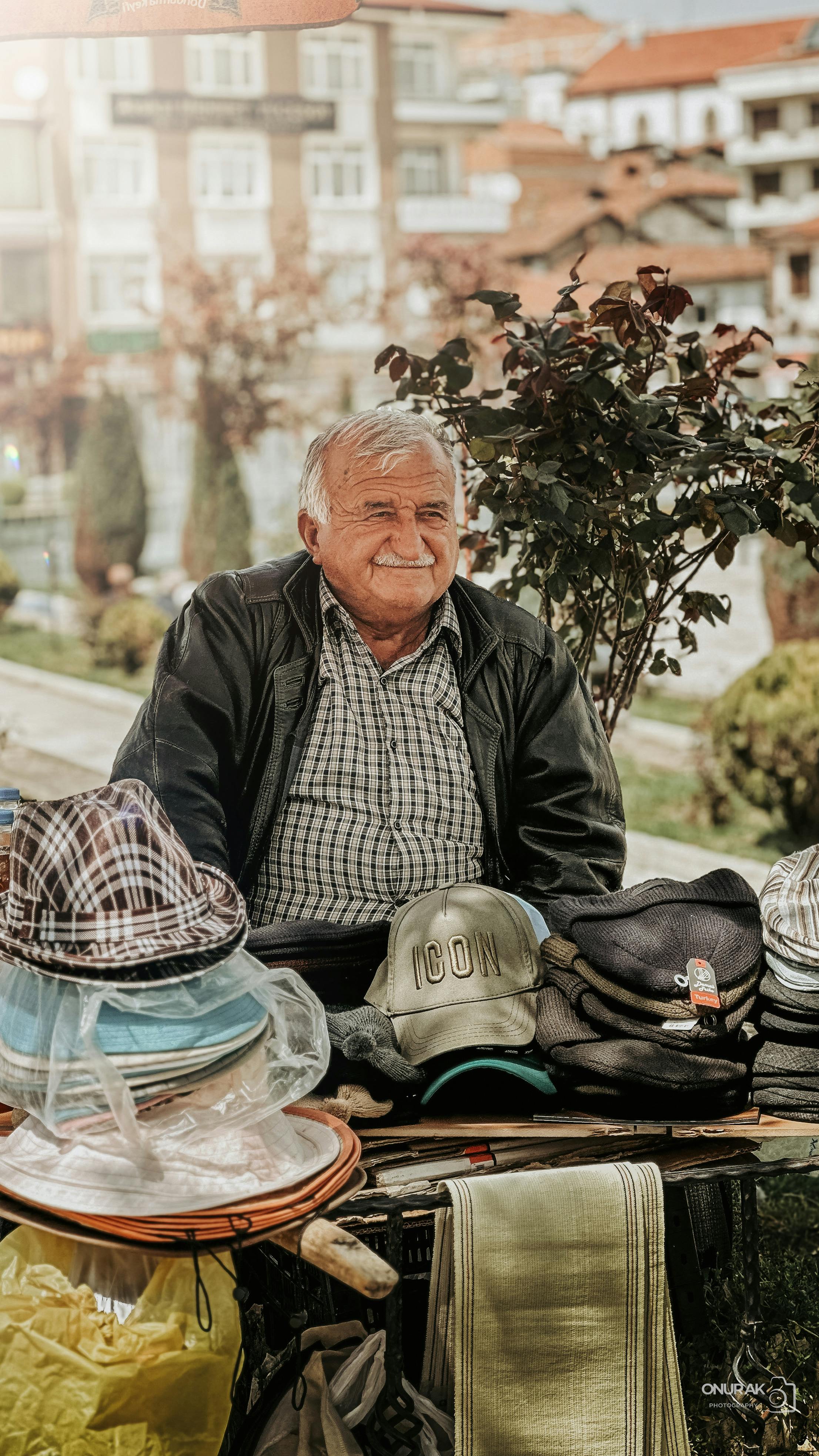 Man Selling Hats on Street · Free Stock Photo
