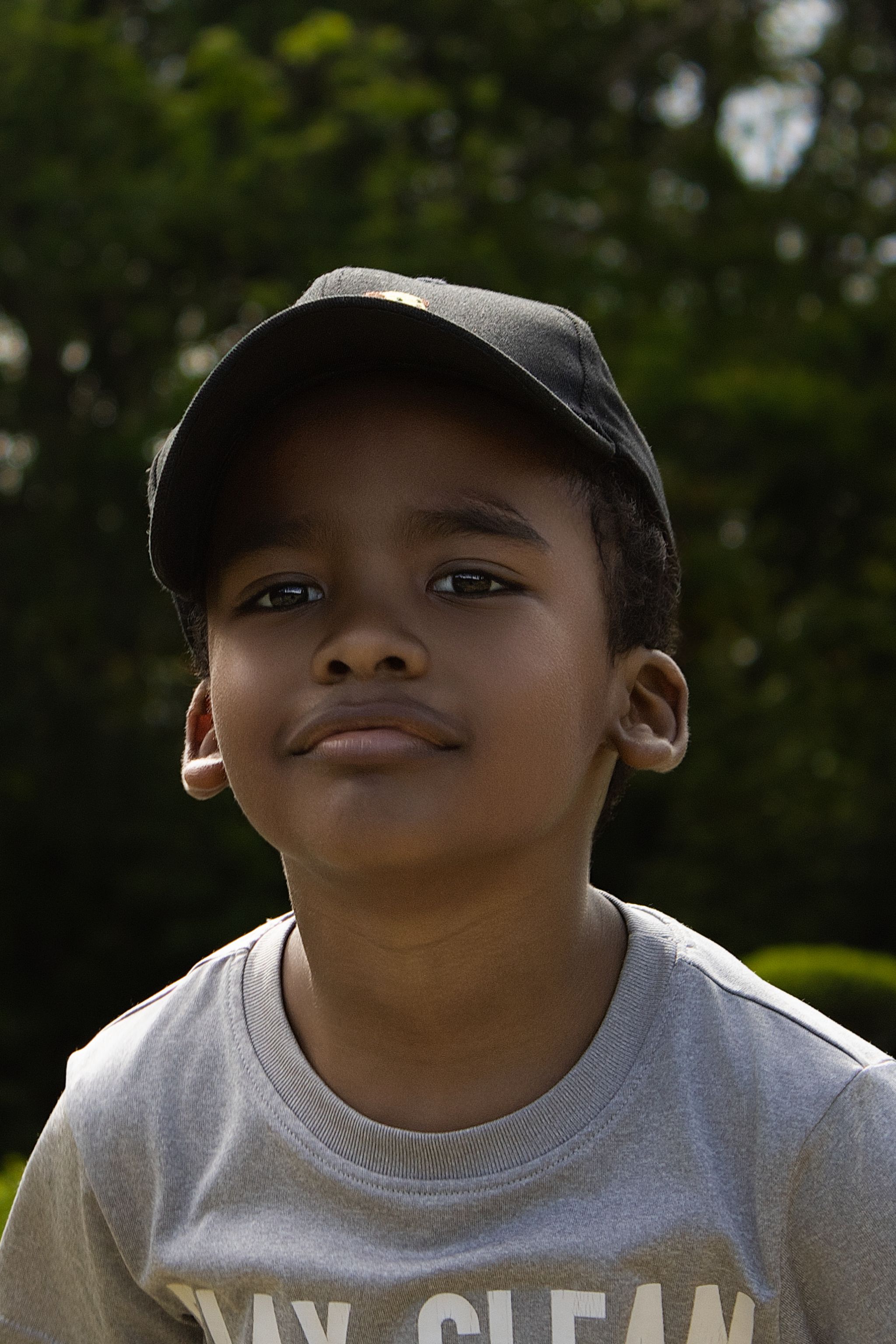Portrait of a Little Boy Wearing a Cap · Free Stock Photo