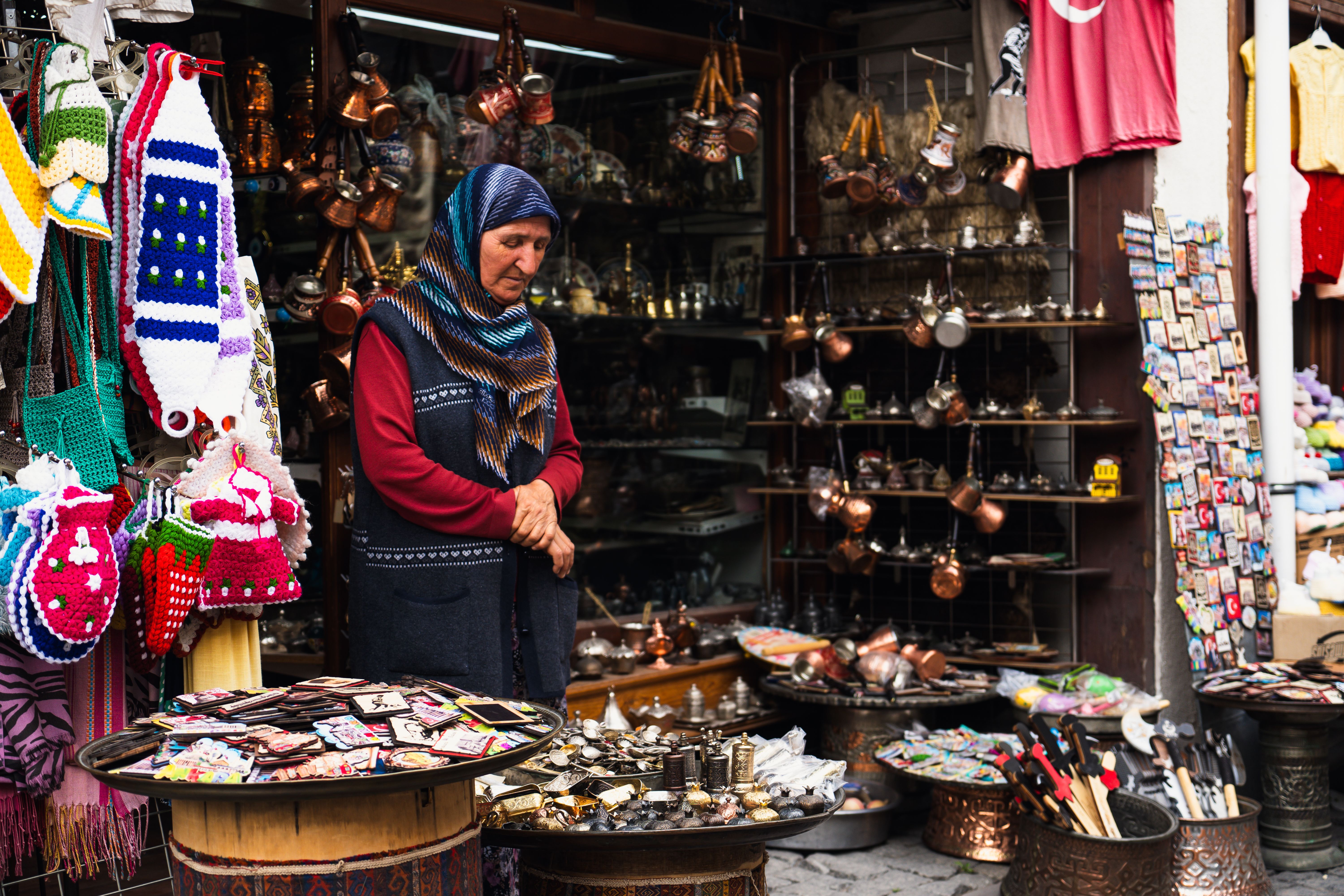 Woman in Traditional Clothing at Store at Bazaar · Free Stock Photo