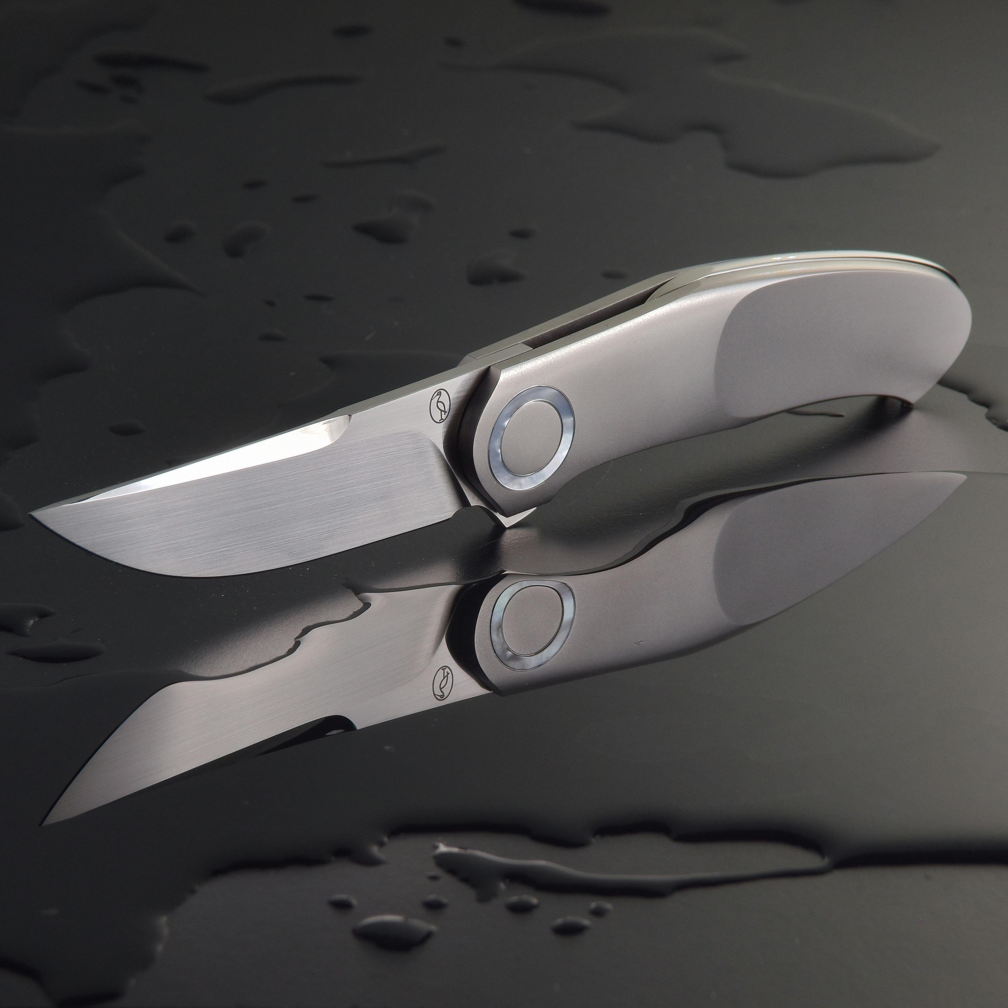 Sharp Pocket Knife Reflecting in a Puddle of Water · Free Stock Photo