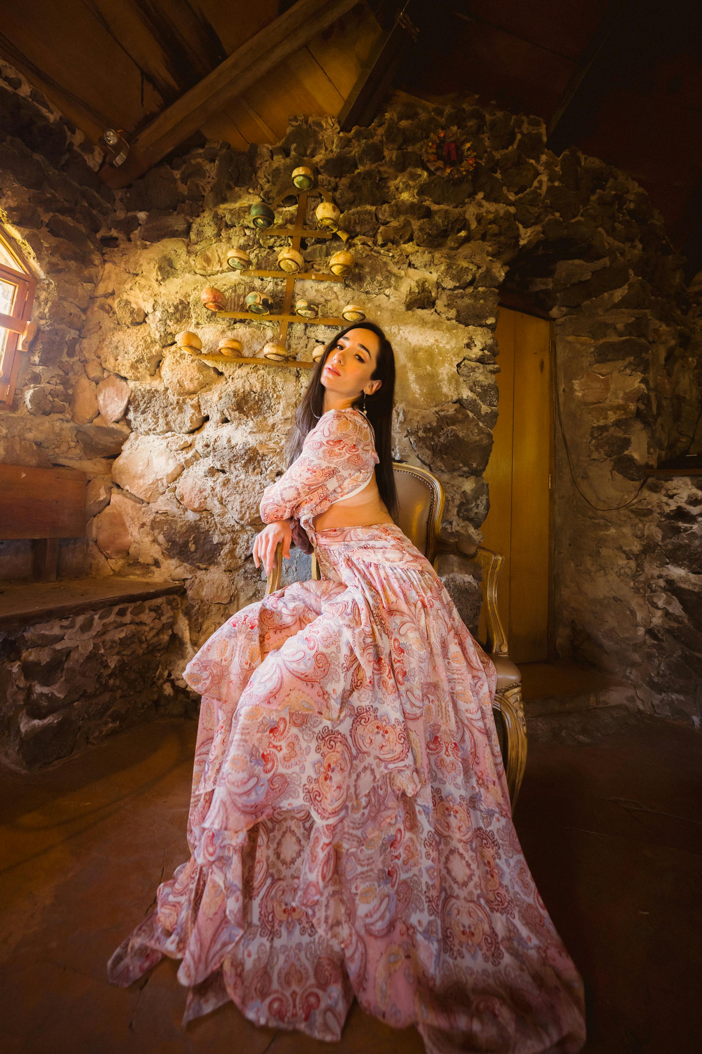 Photo of a Woman in a Maxi Dress Sitting on a Chair · Free Stock Photo