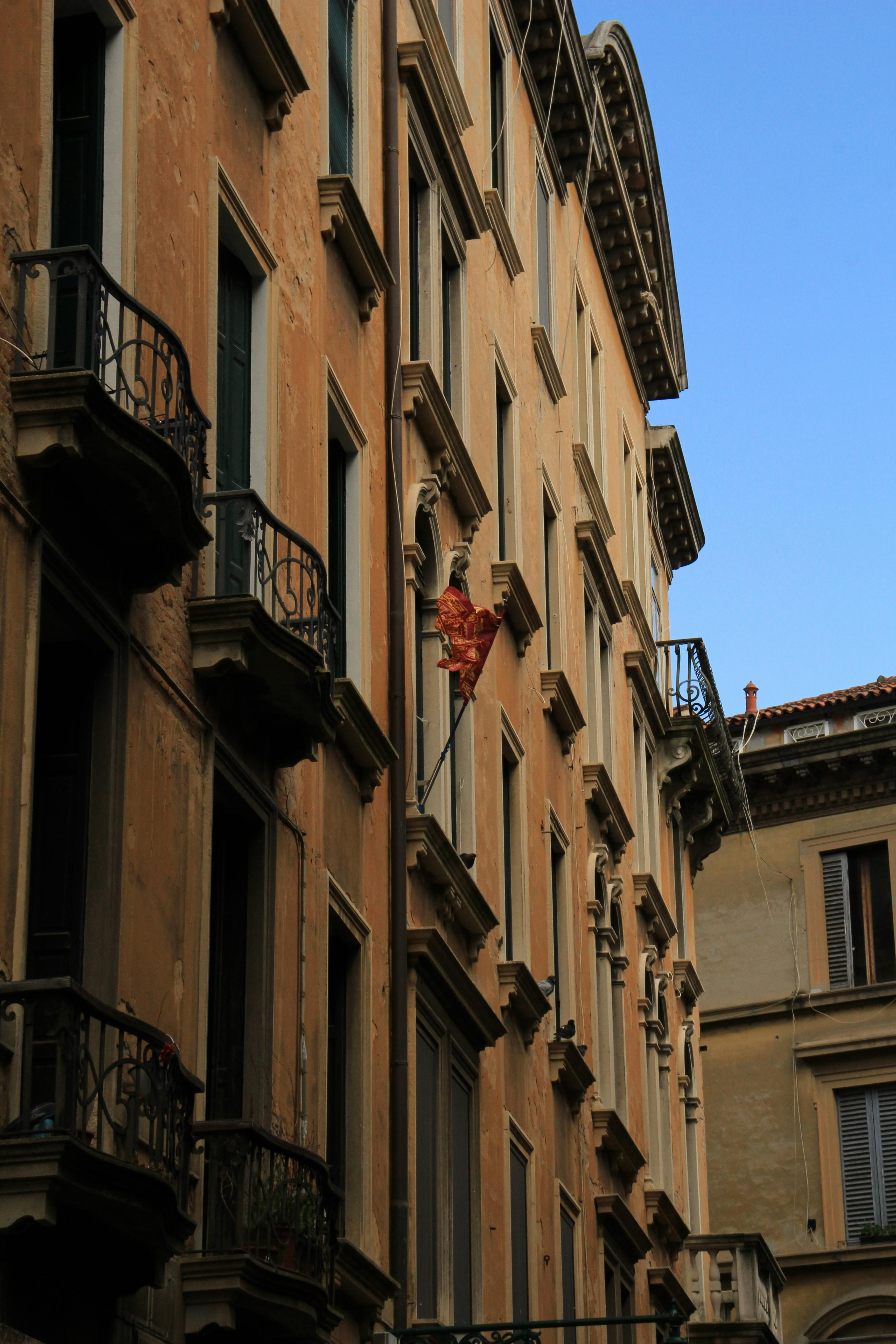 Low Angle Shot of a Typical Italian Apartment Building · Free Stock Photo