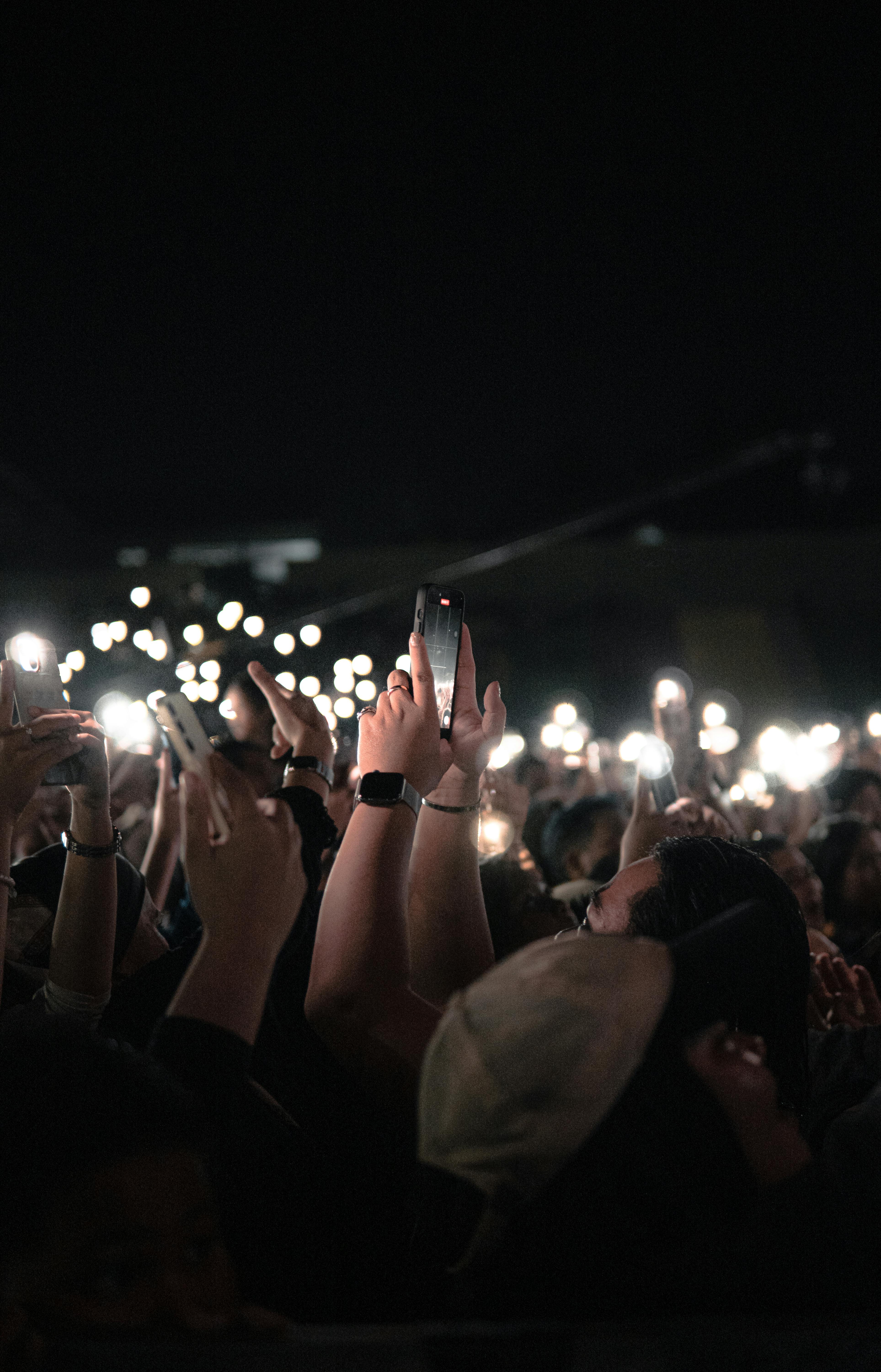 Audience Flashing their Phones Flashlight · Free Stock Photo