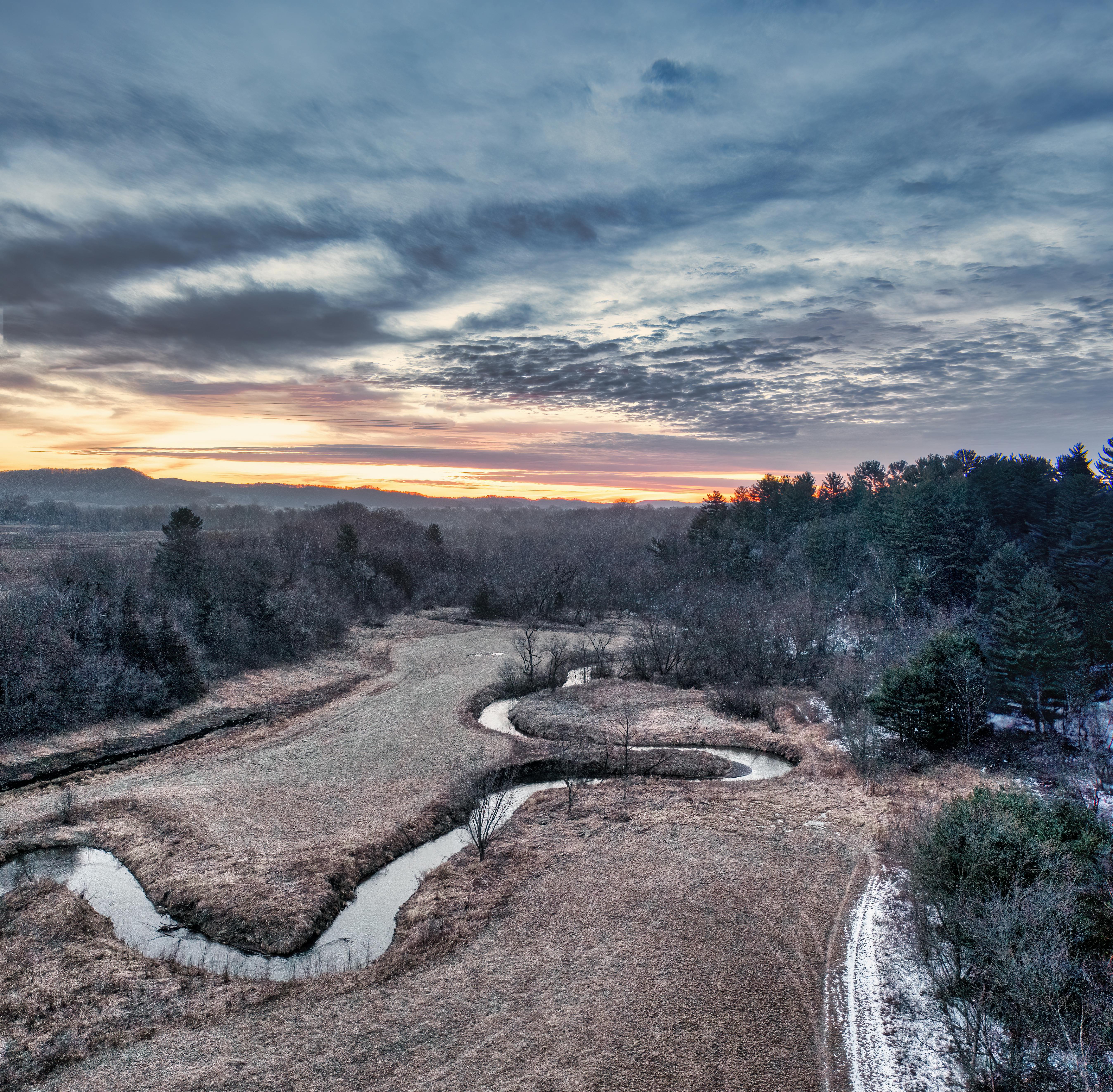 S-Shaped River in Arid Landscape at Sunset · Free Stock Photo