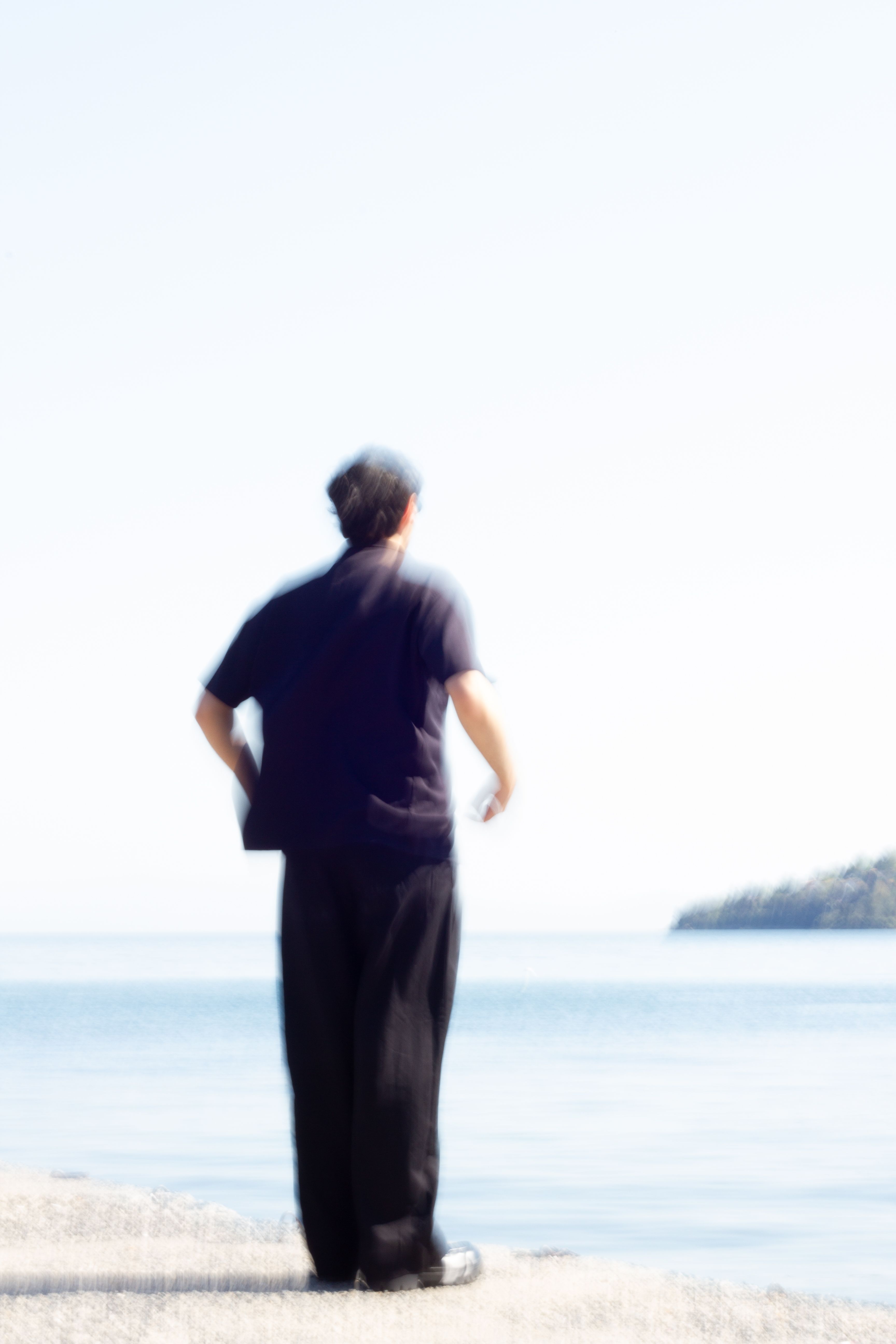 A Calm Figure Standing Still While Everything Around Them Is Blurred ...