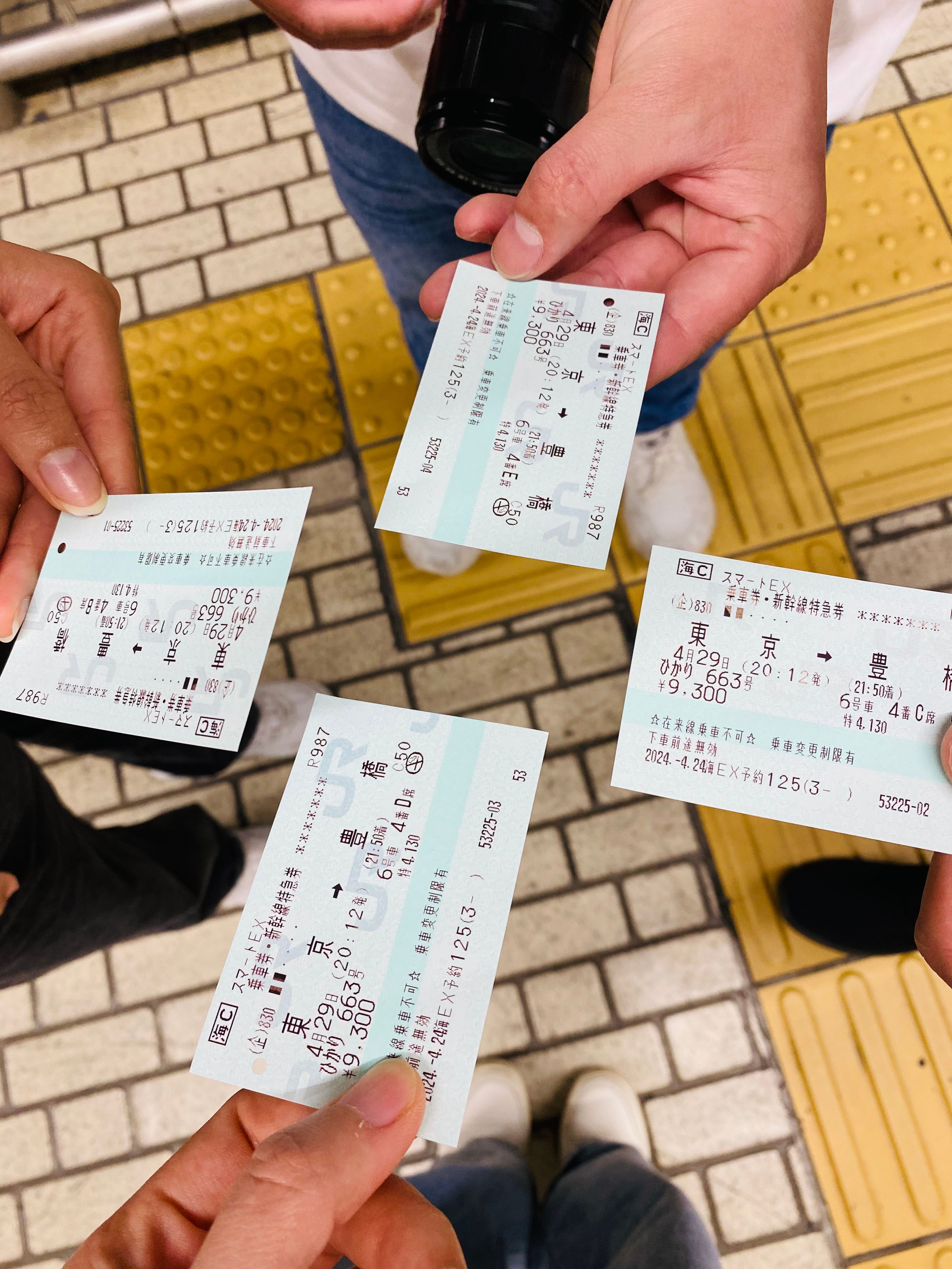 People holding up tickets in a subway station · Free Stock Photo