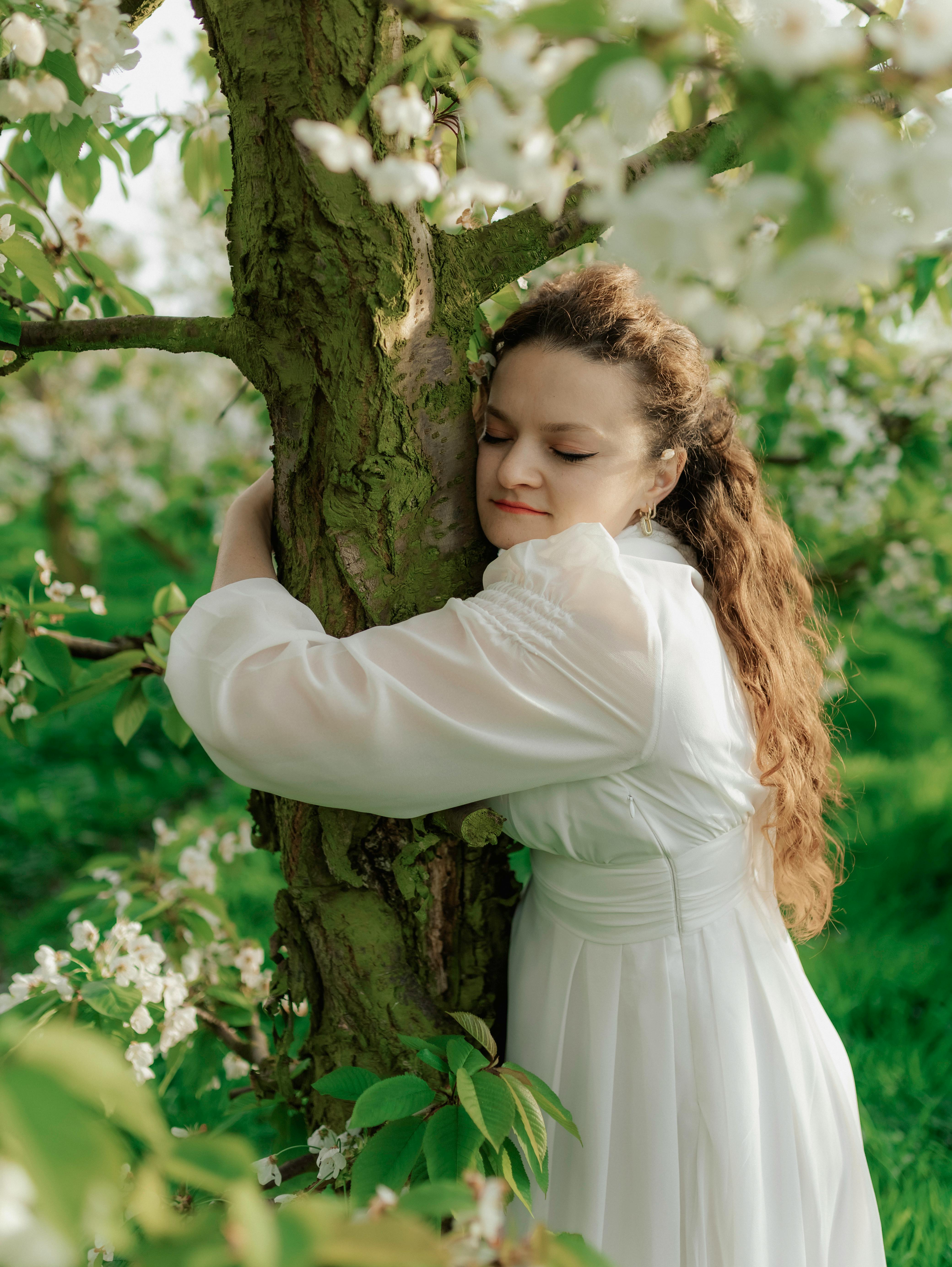 Woman Hugging a Tree in Spring · Free Stock Photo