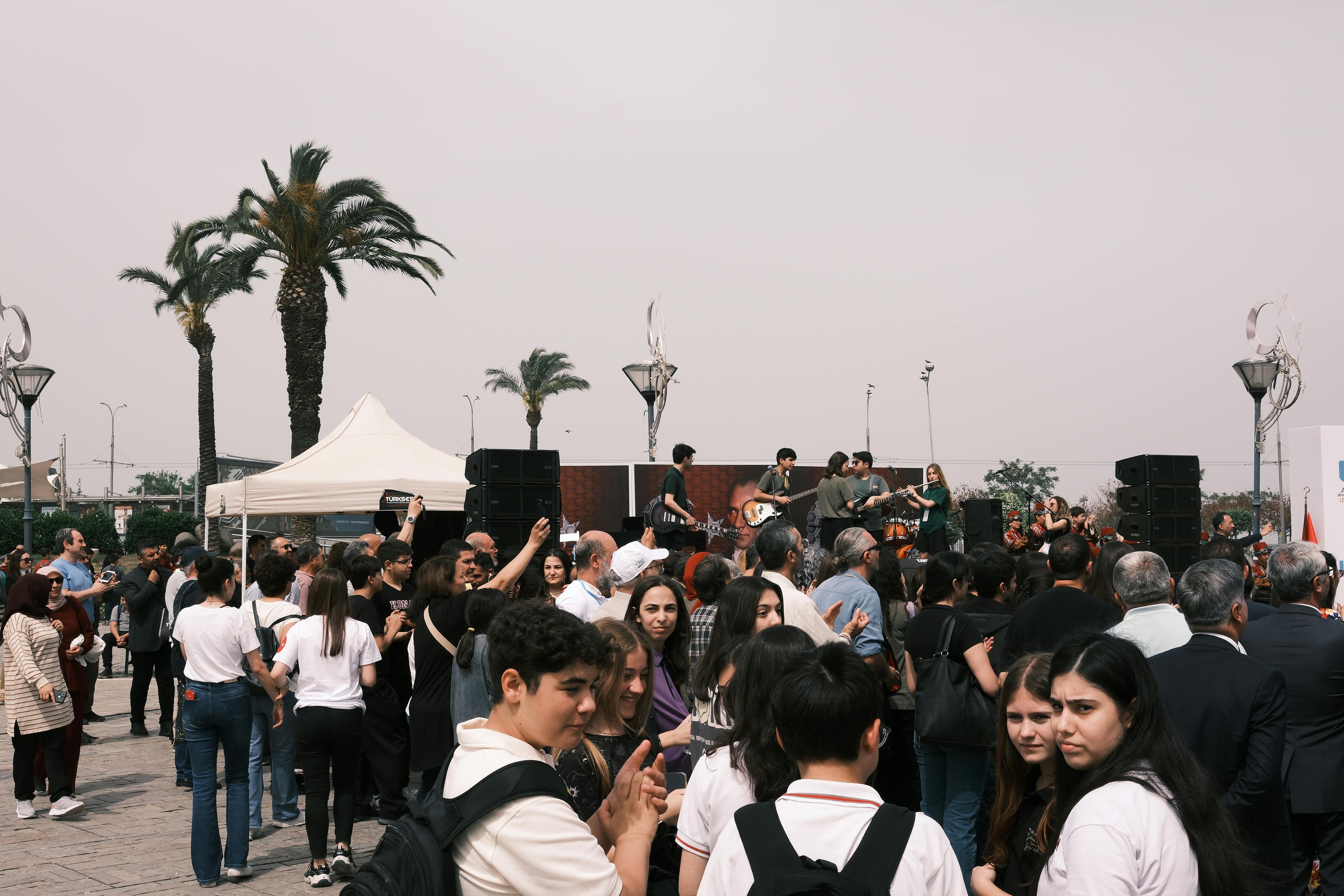 A crowd of people standing around a stage · Free Stock Photo