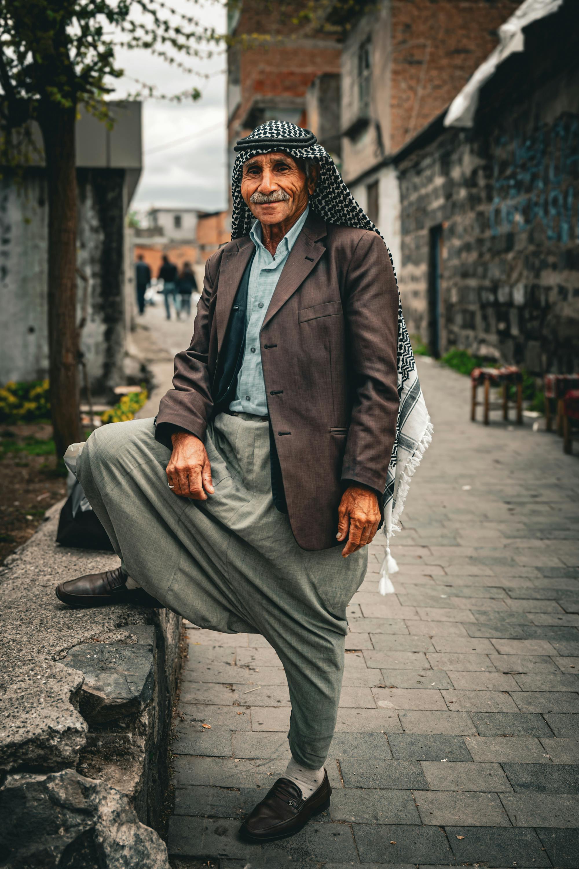 Smiling Man Standing on Sidewalk · Free Stock Photo