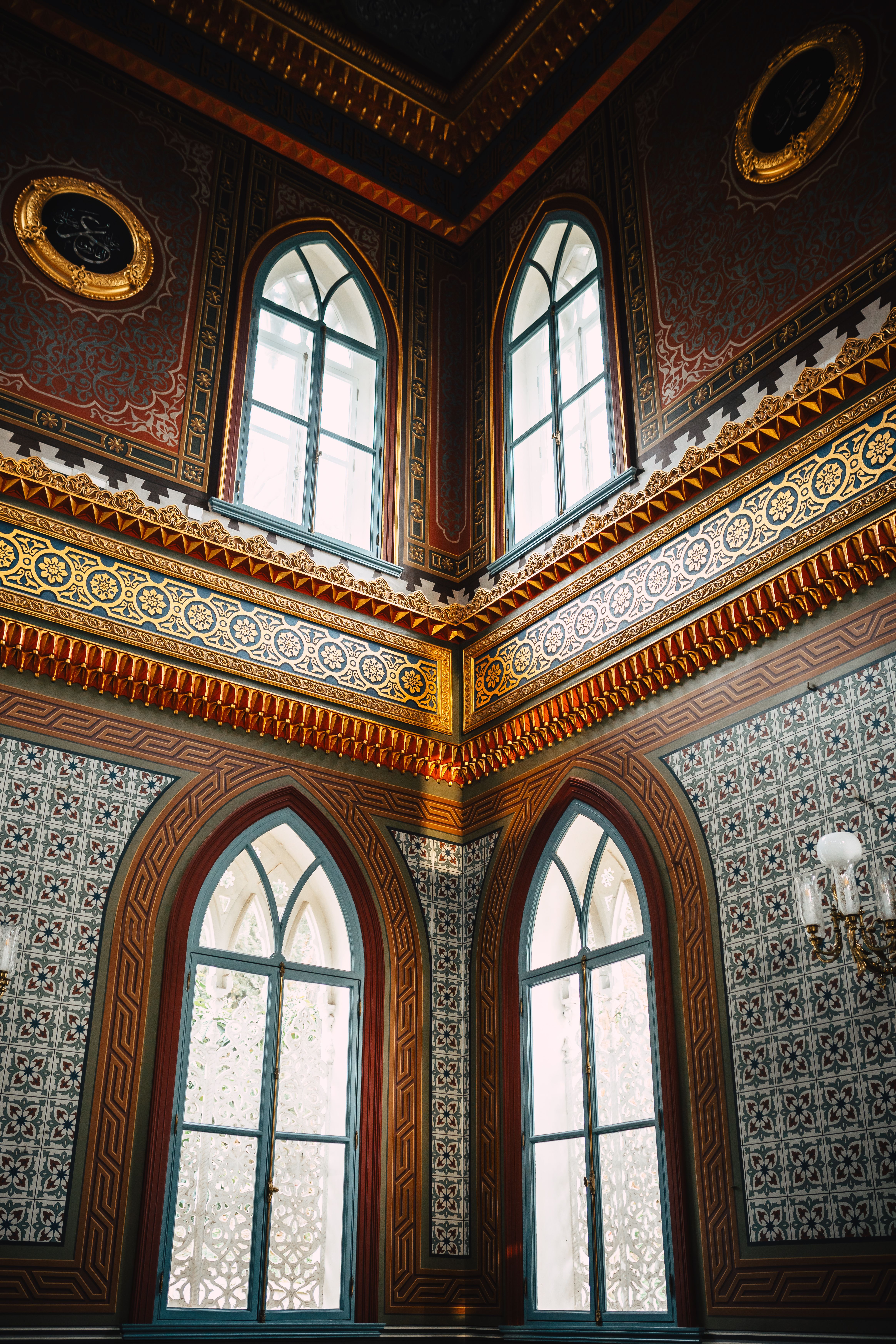 The interior of a building with ornate windows · Free Stock Photo