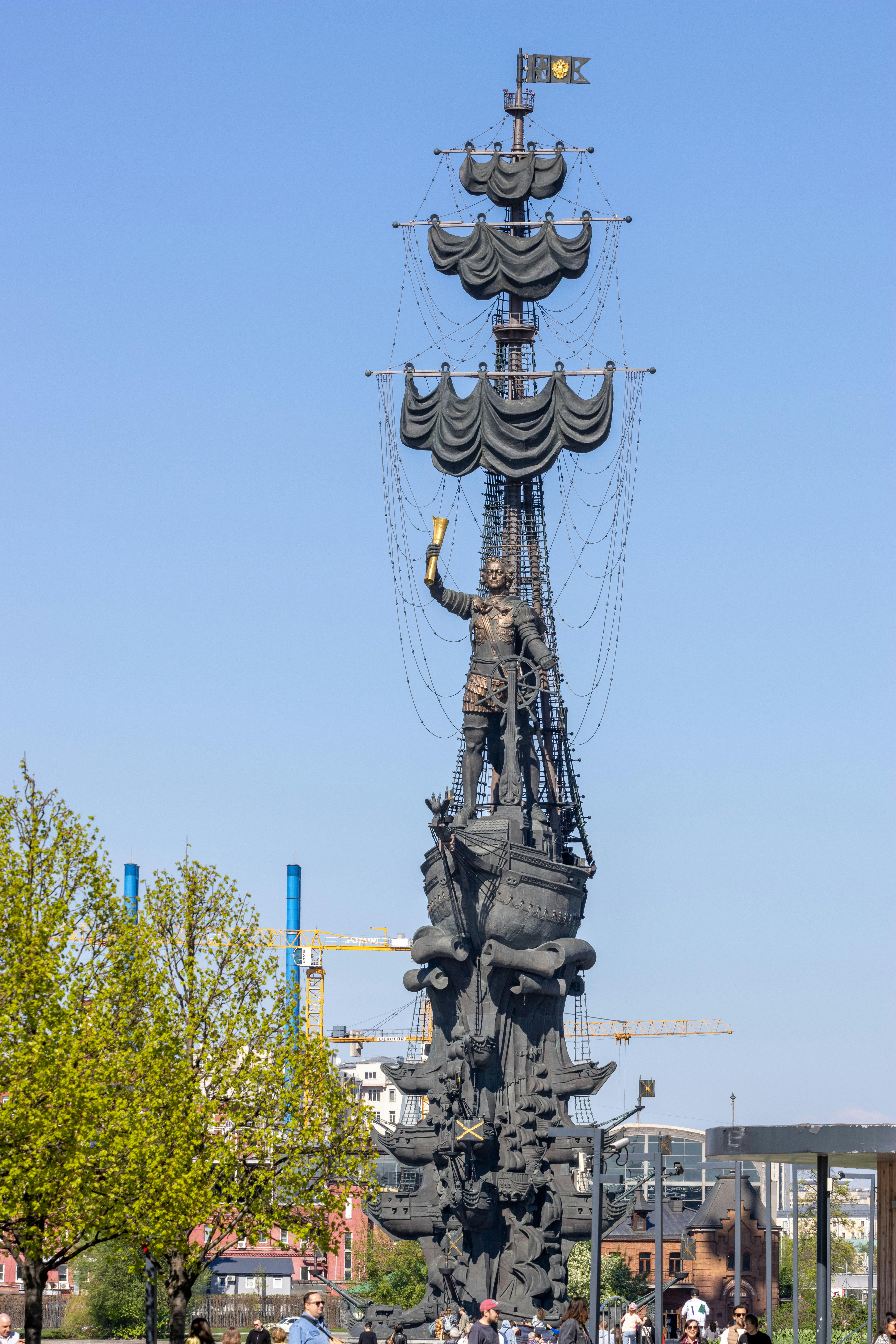 A statue of a ship with a sail on it · Free Stock Photo