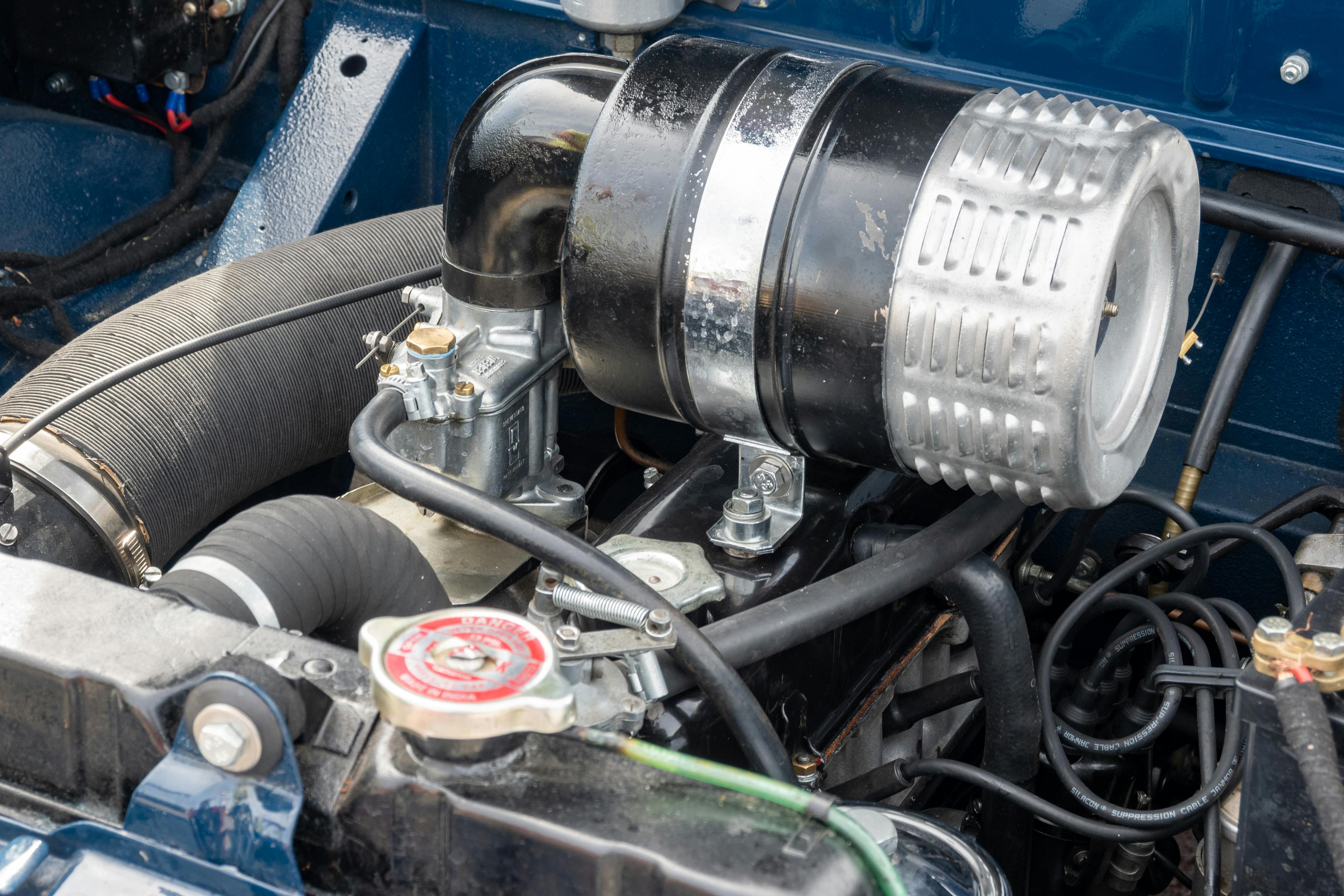 A close up of the engine in a blue car · Free Stock Photo