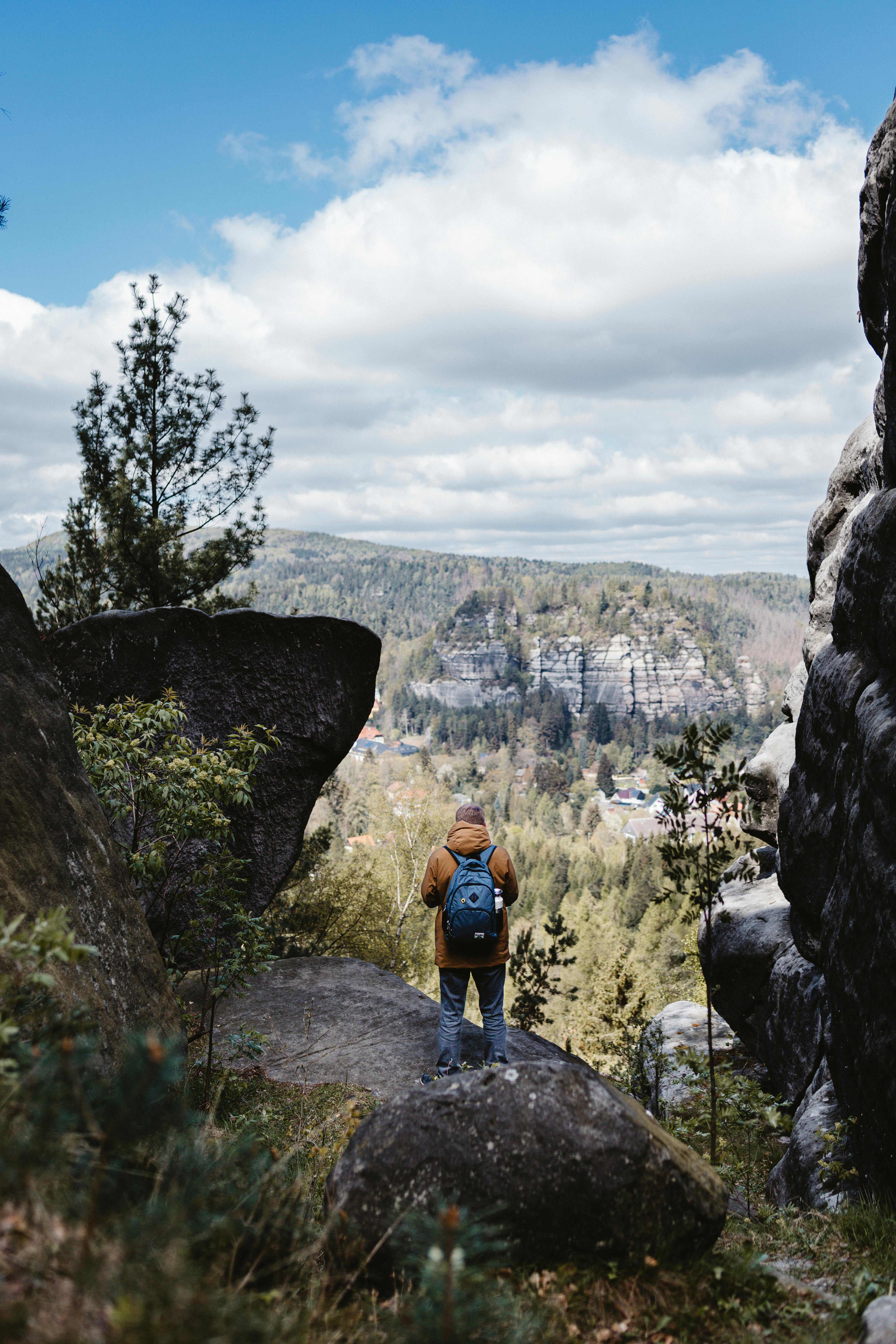 Person Standing on Rocks over Canyon in Zittau Mountains Nature Park in ...