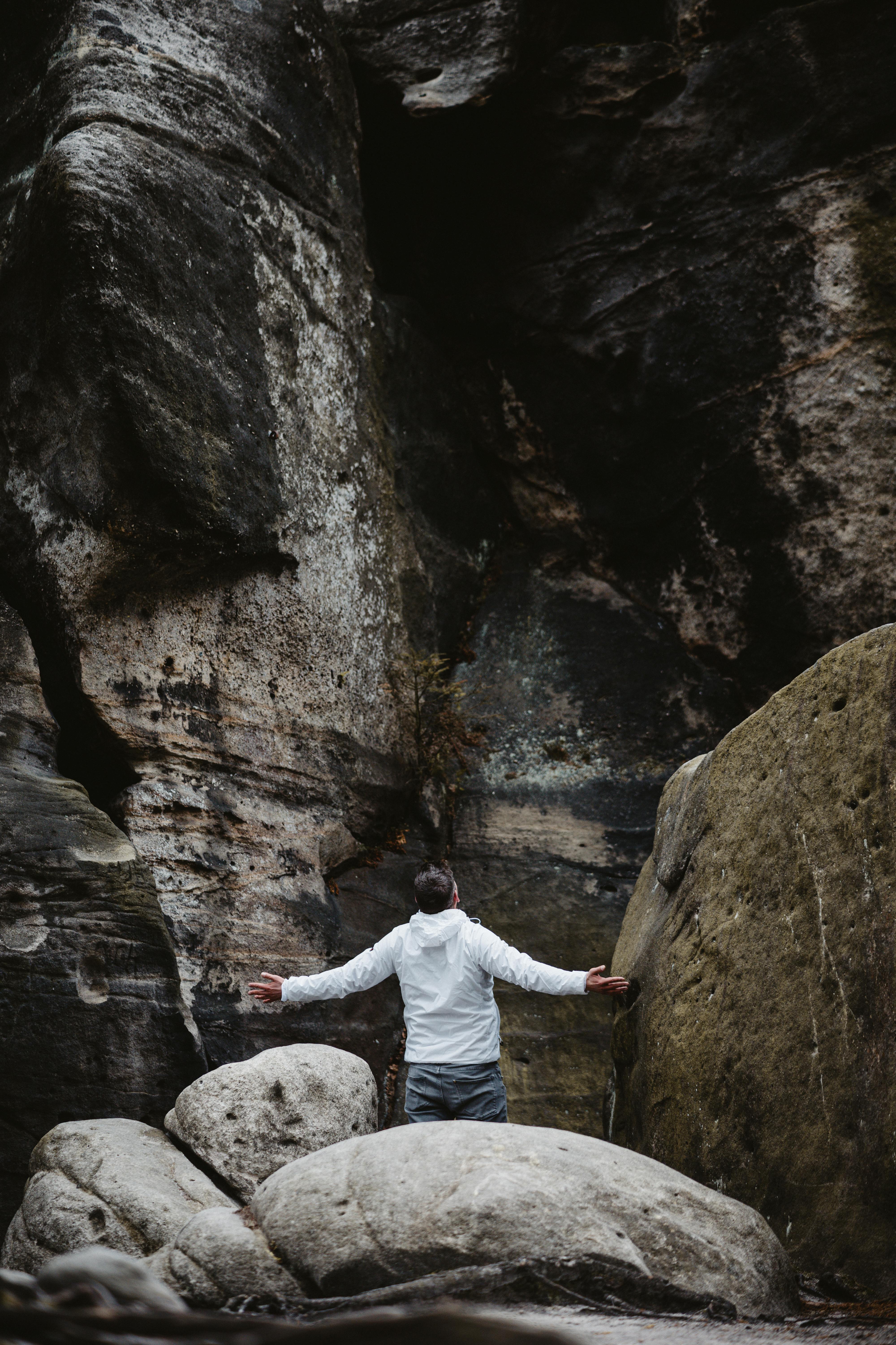 Man Looking at Rock Formation · Free Stock Photo