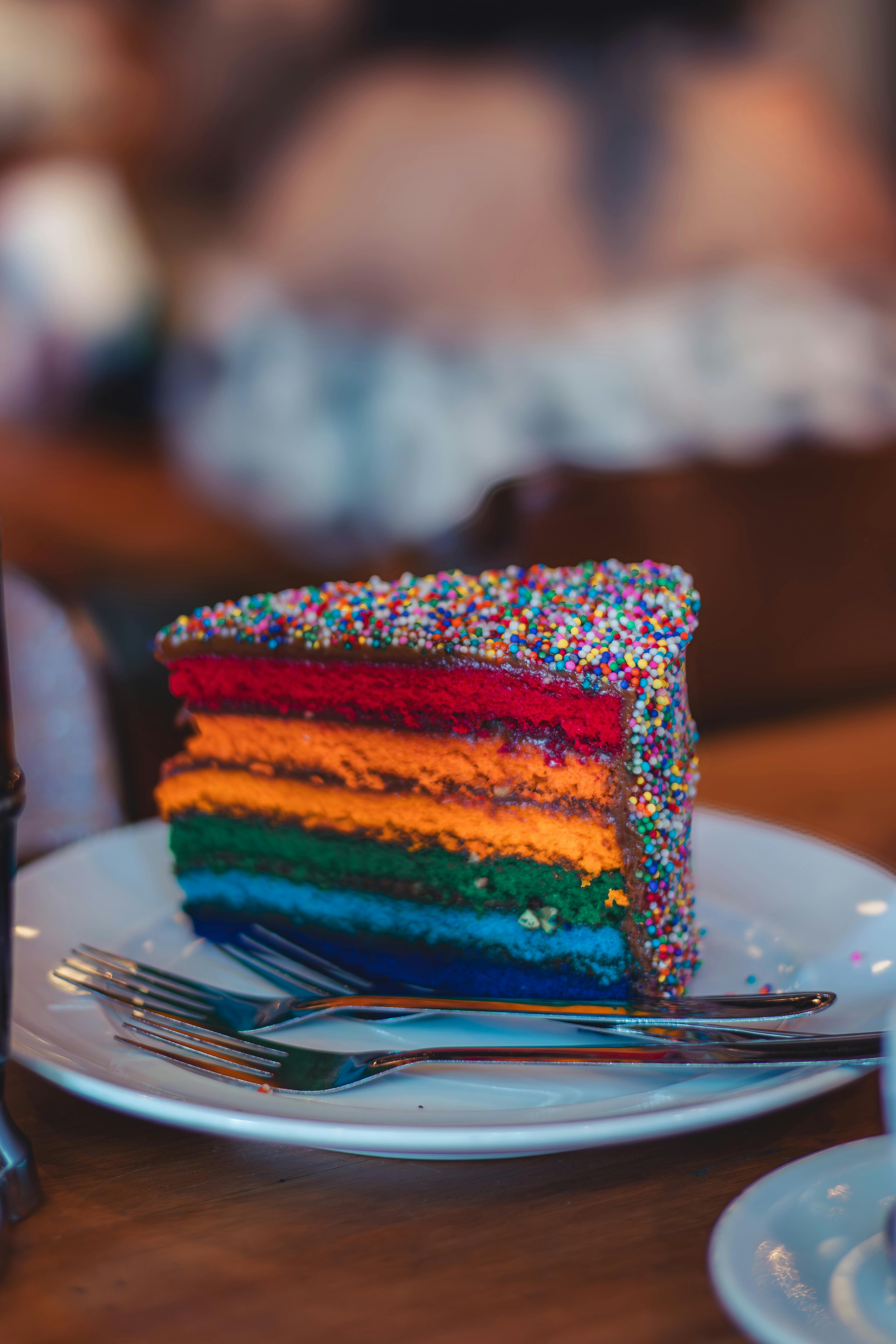 Slice of Colorful Cake on Plate · Free Stock Photo
