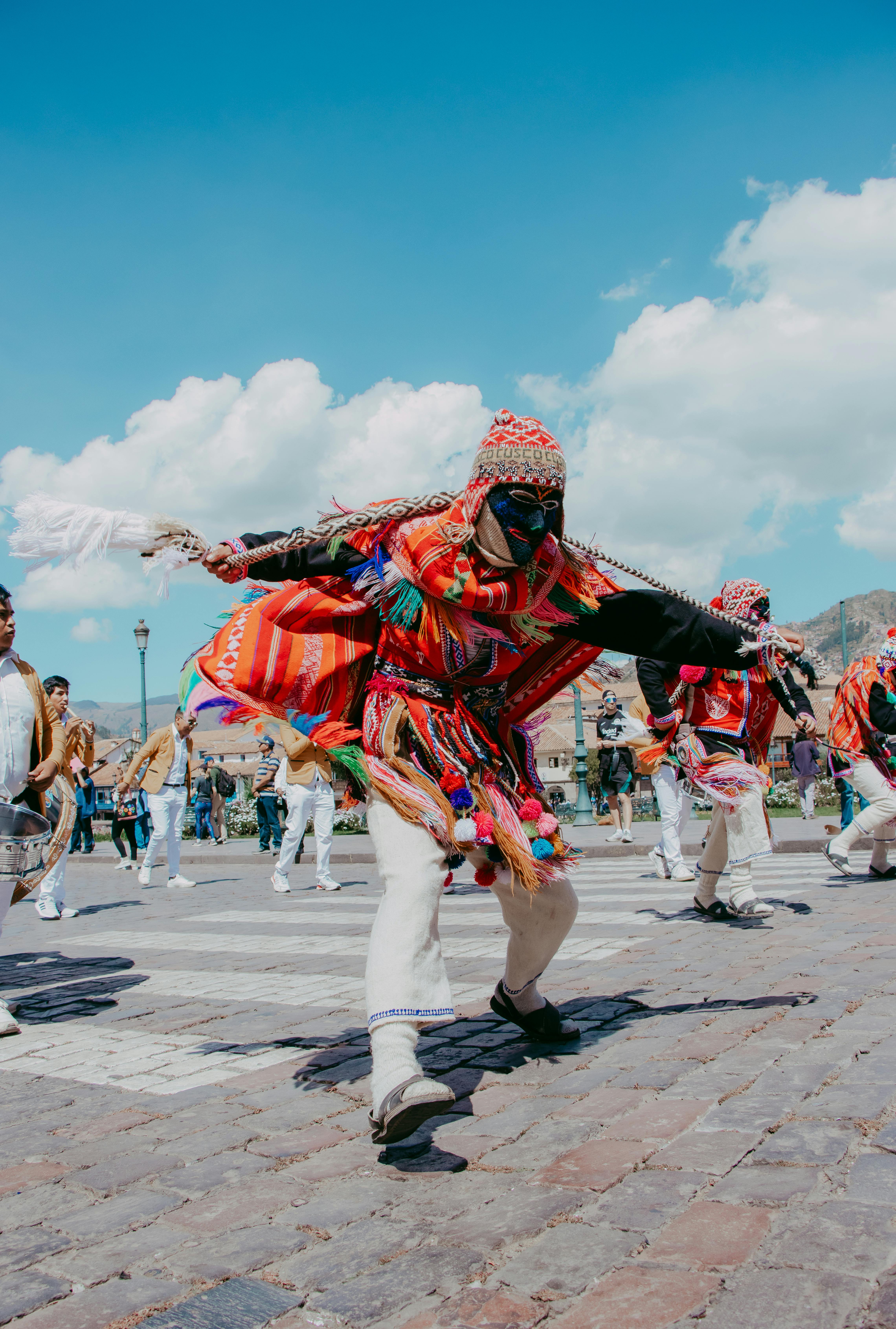 Dancers in Traditional Costumes and Masks Celebrating in Peru · Free ...