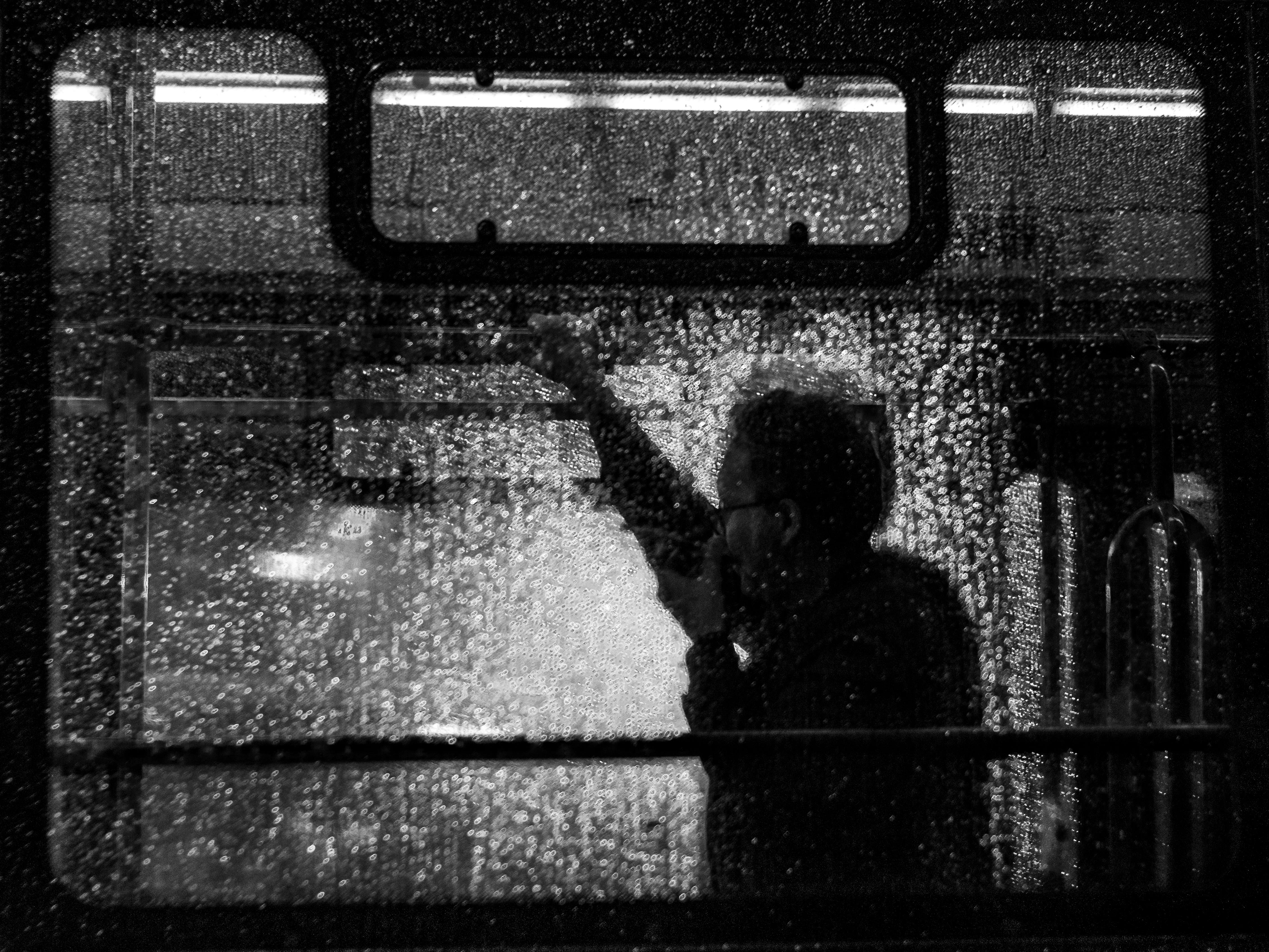 Man Leaning On Glass Window Watching The Rain · Free Stock Photo
