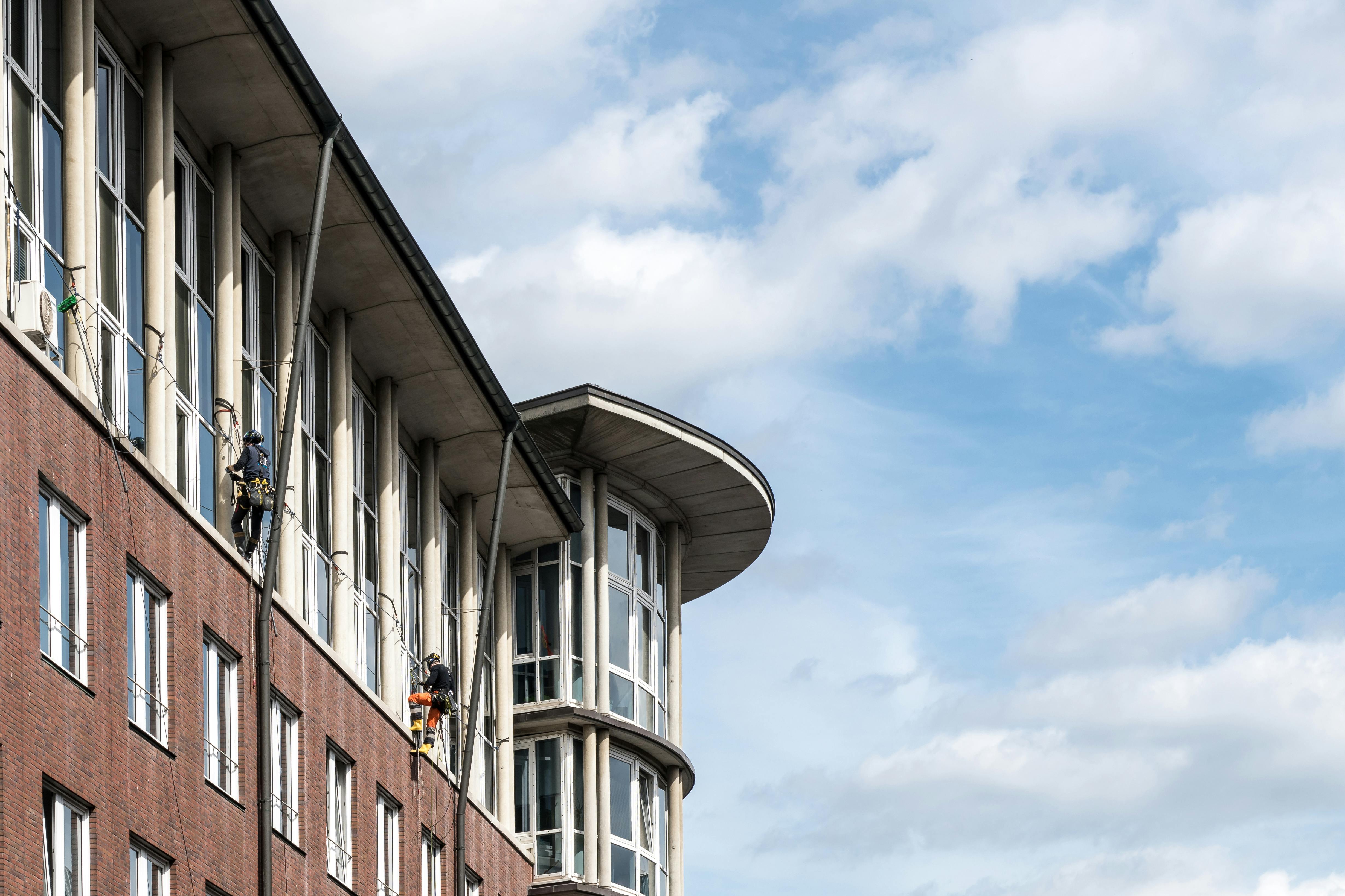 Men Cleaning the Building Exterior · Free Stock Photo