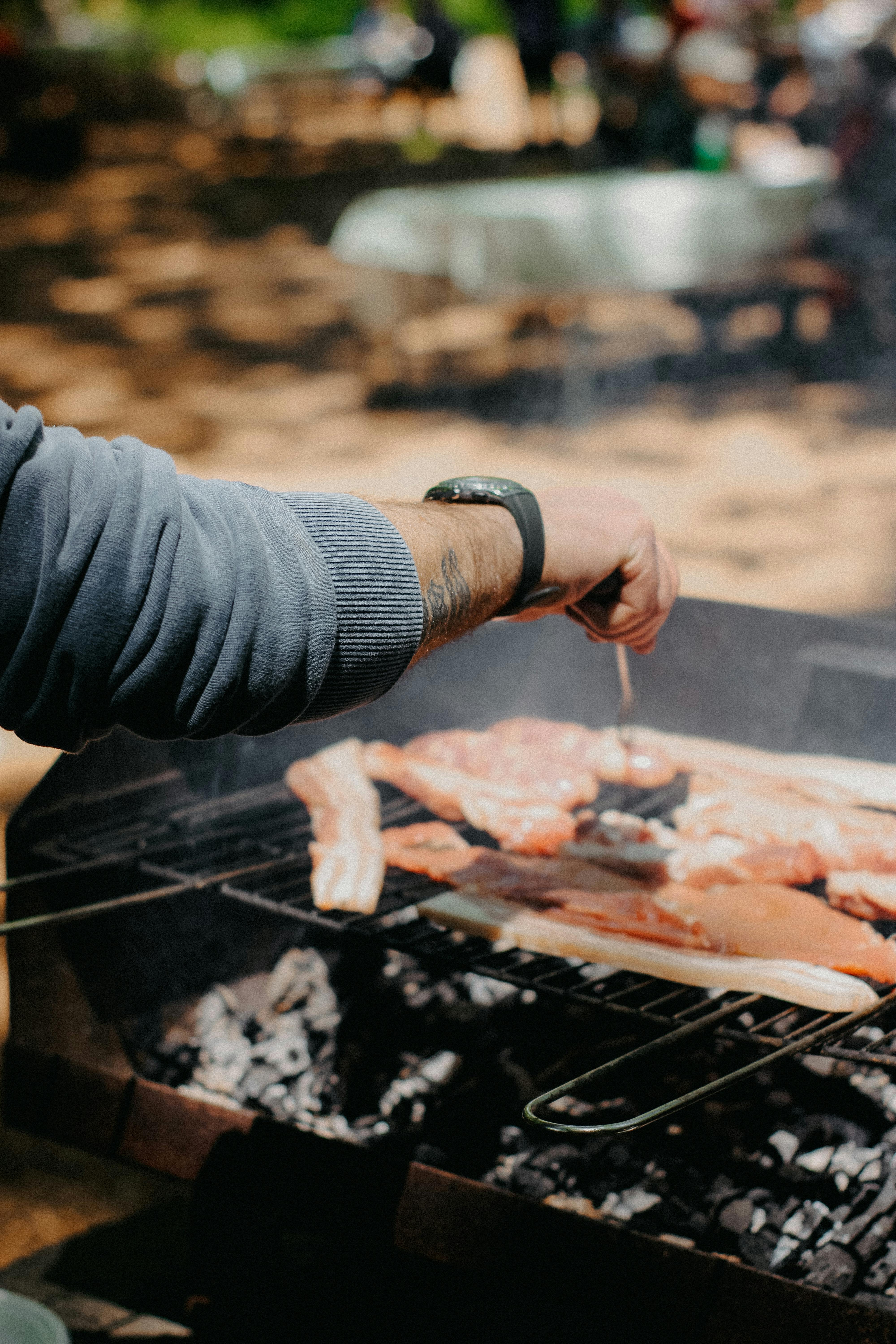 Hand over Meat on Barbecue · Free Stock Photo