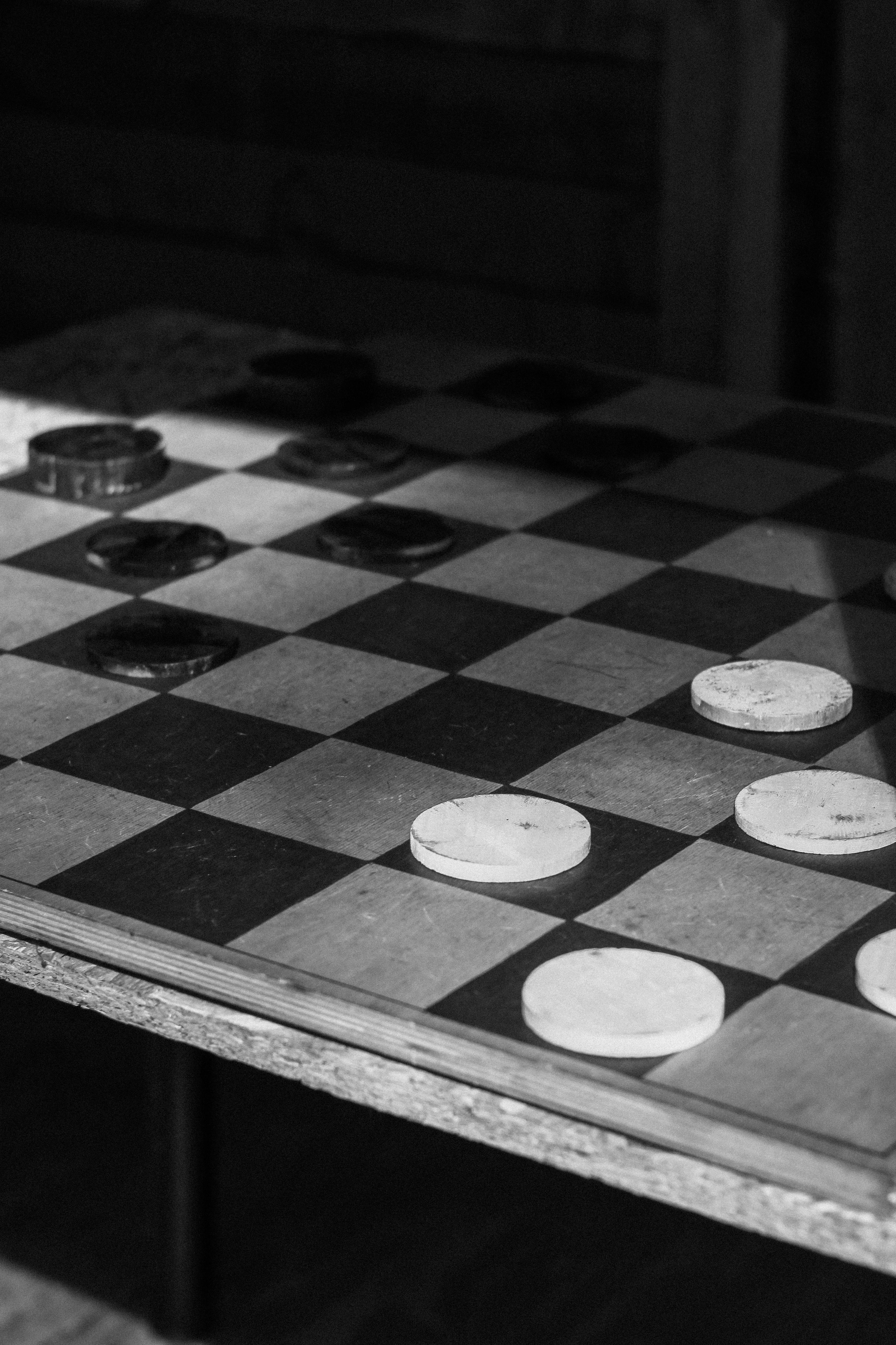 Black and White Shot of a Checkers Board · Free Stock Photo