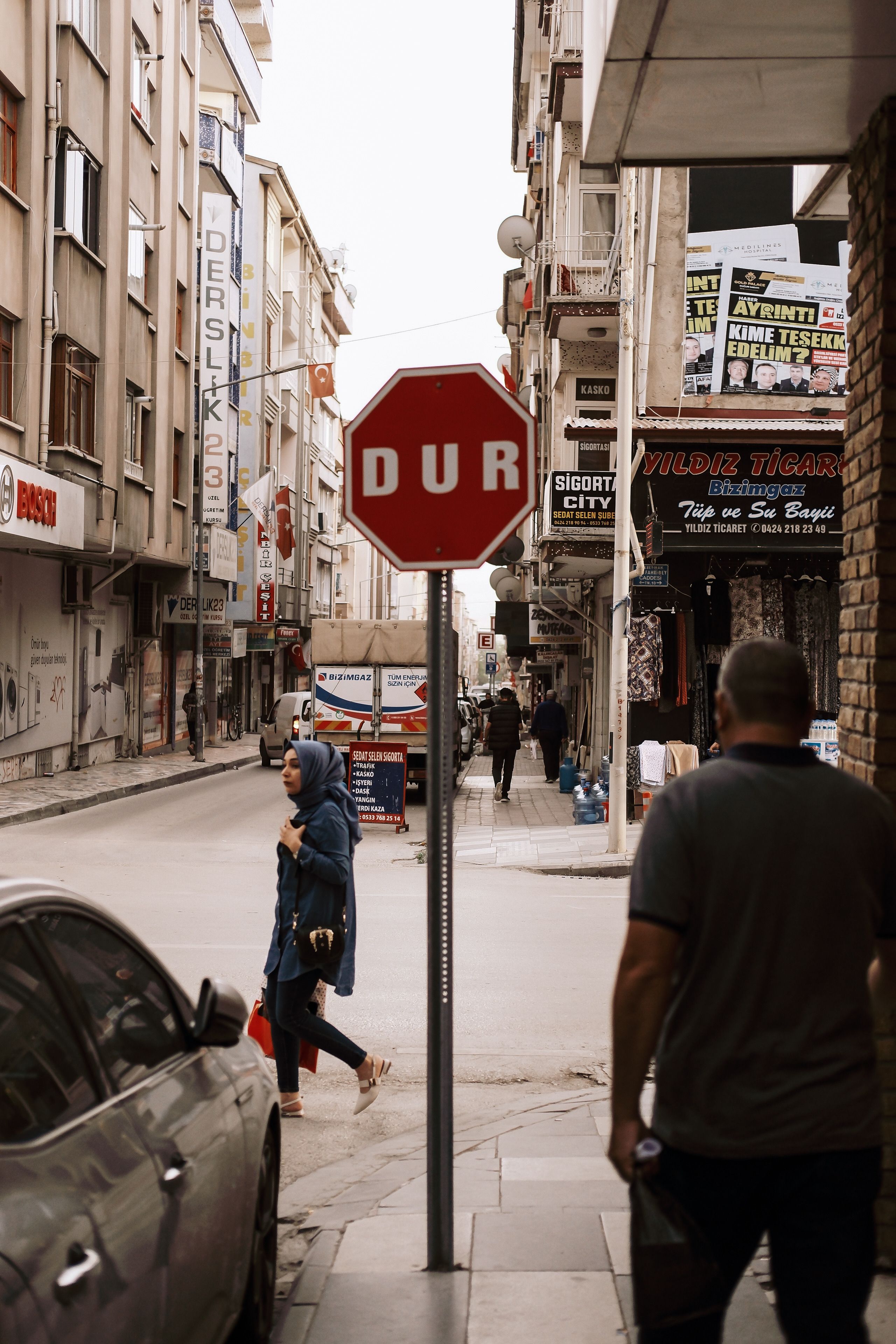A stop sign on a street corner · Free Stock Photo