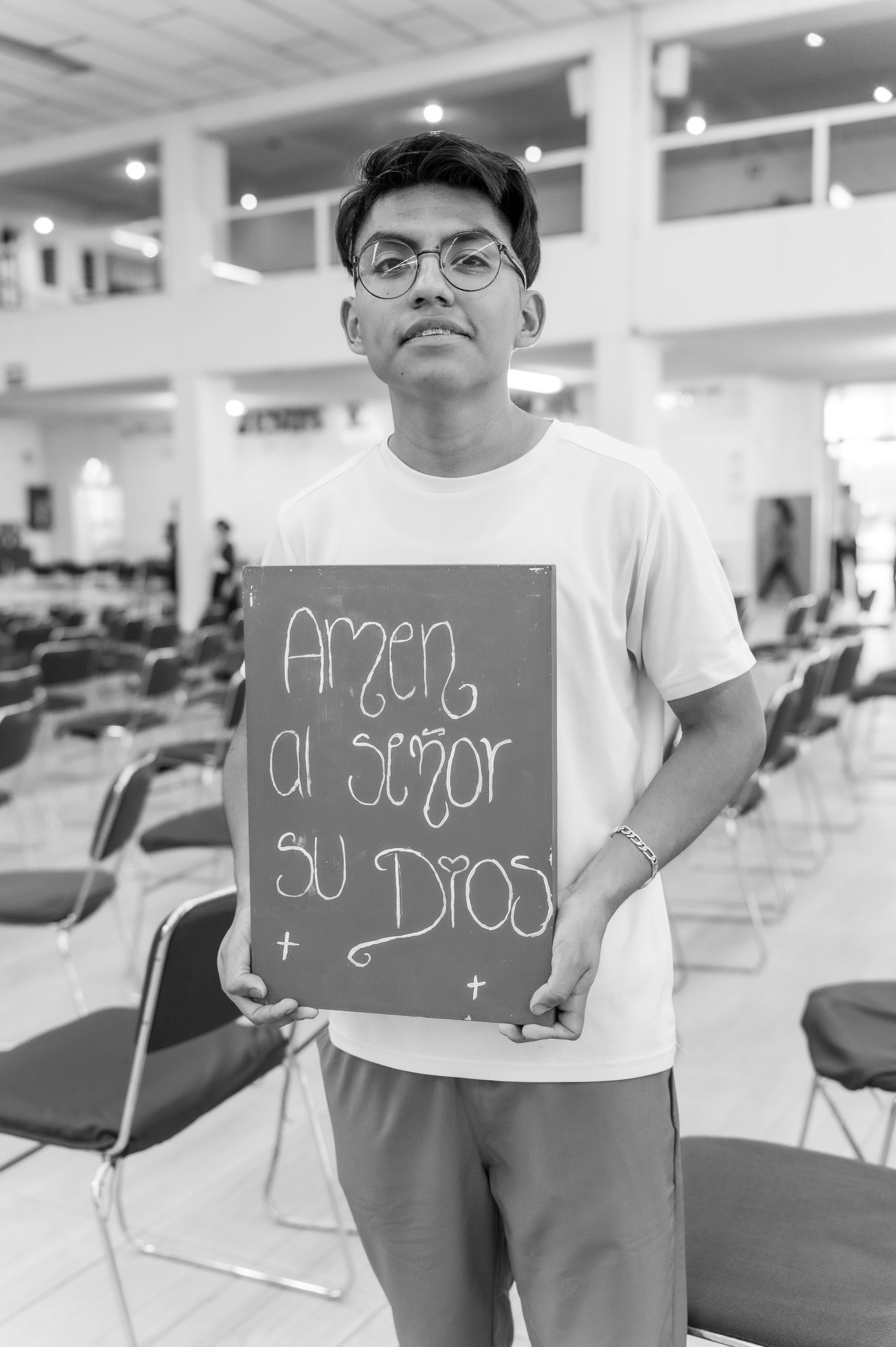 Christian Man Holding Poster in Hands in Church · Free Stock Photo