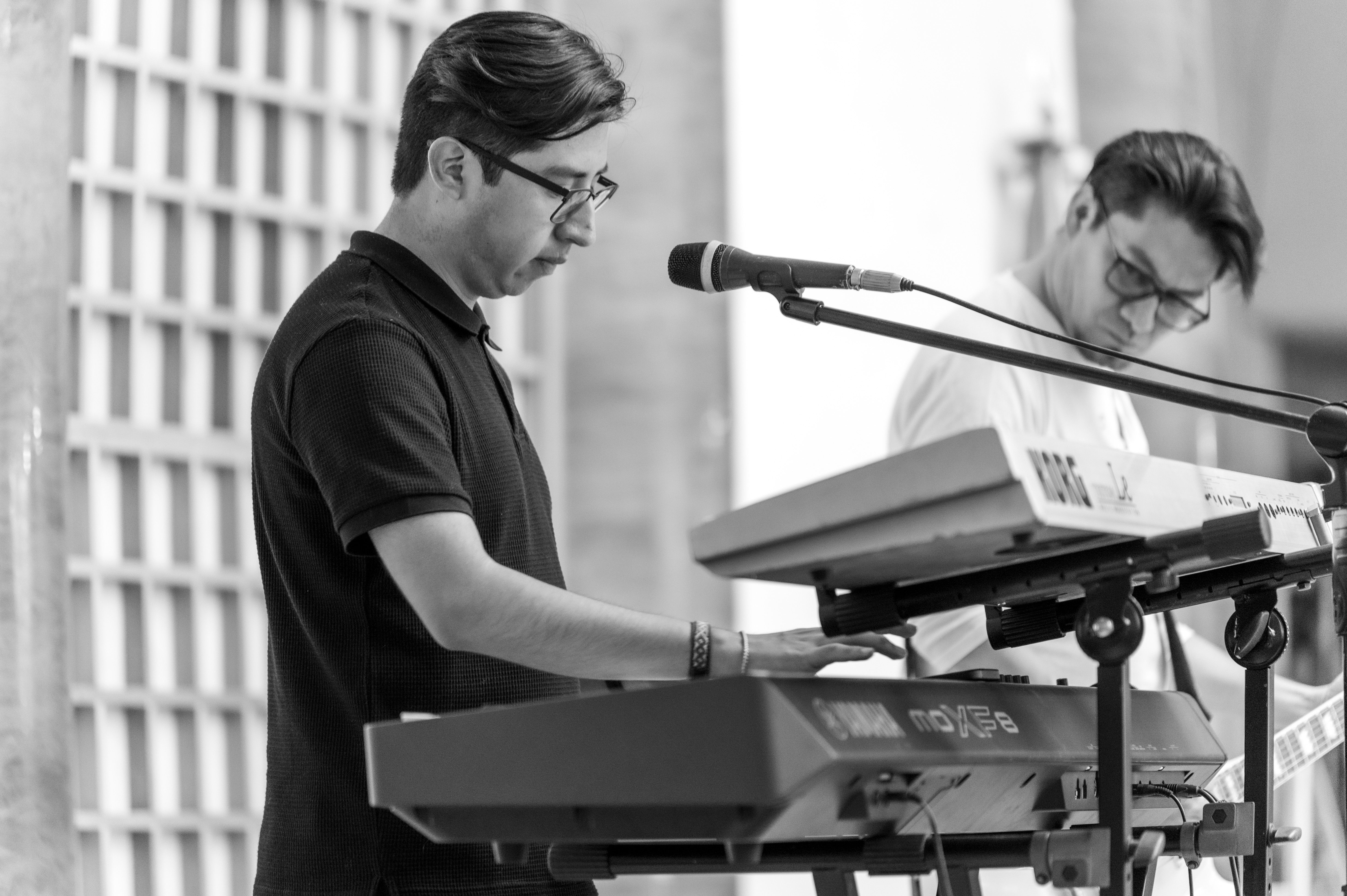 Men Playing Keyboards at Concert · Free Stock Photo