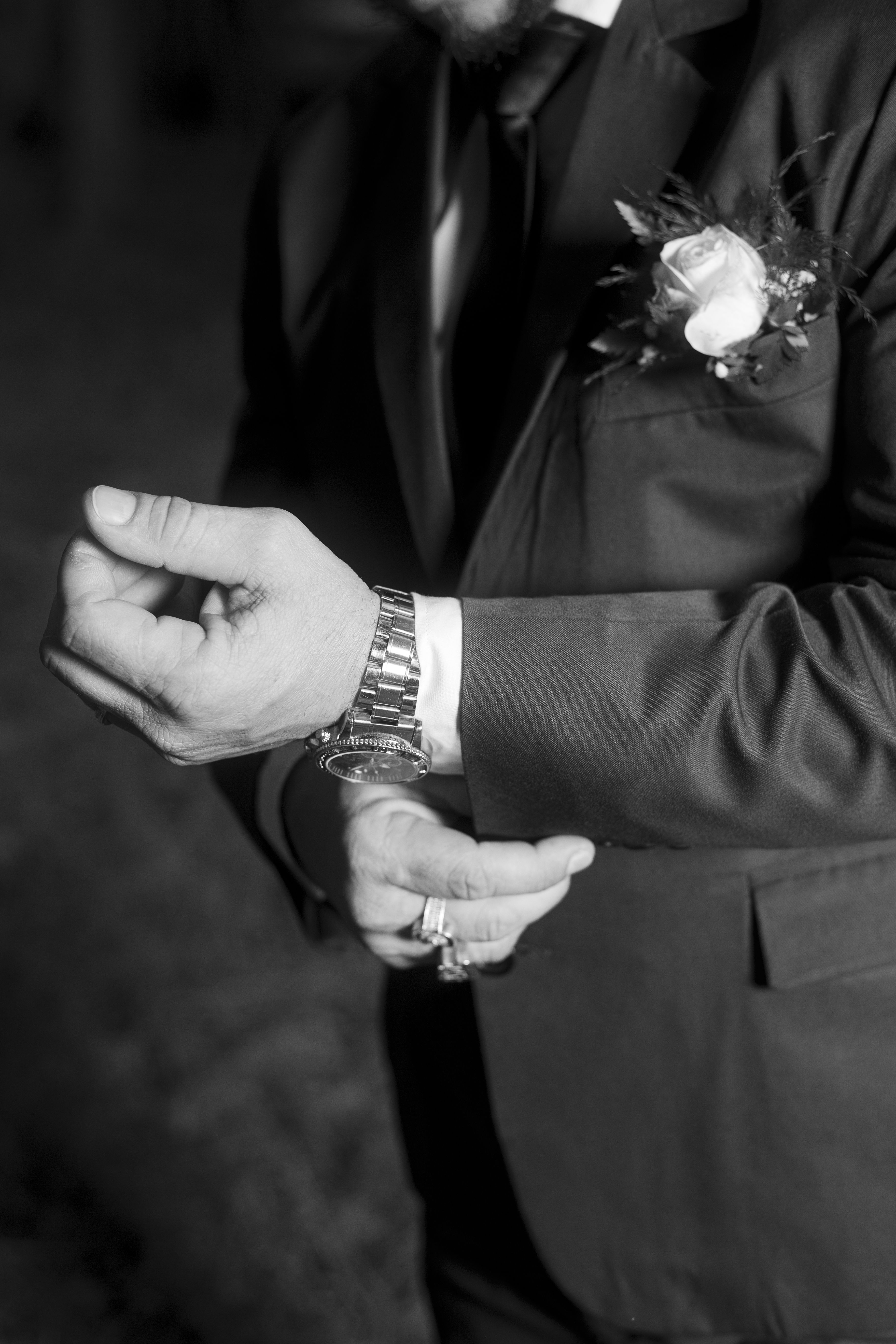 Man in a Suit Straightening His Cuff · Free Stock Photo