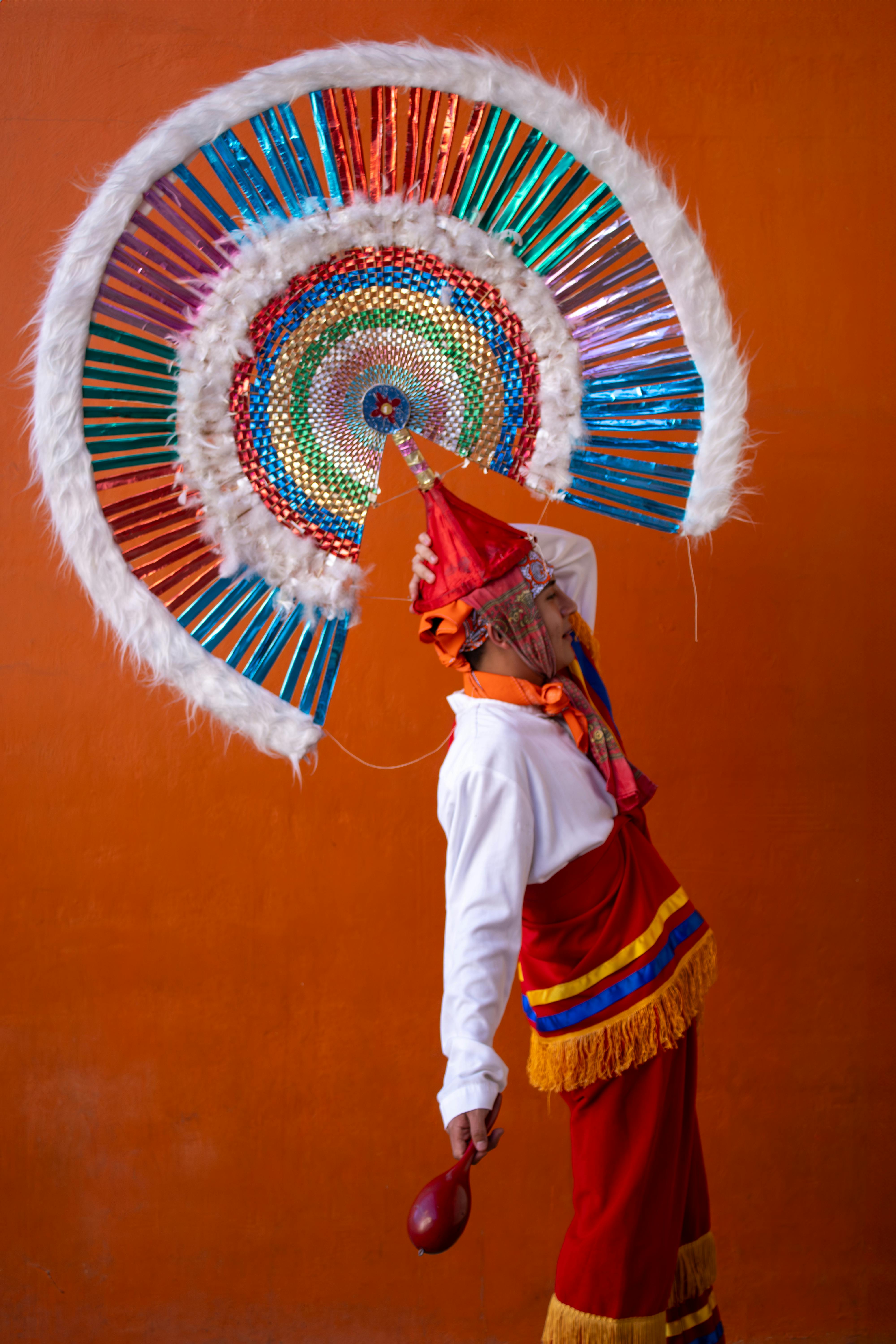 Man in Traditional Clothing with Hat with Plume · Free Stock Photo