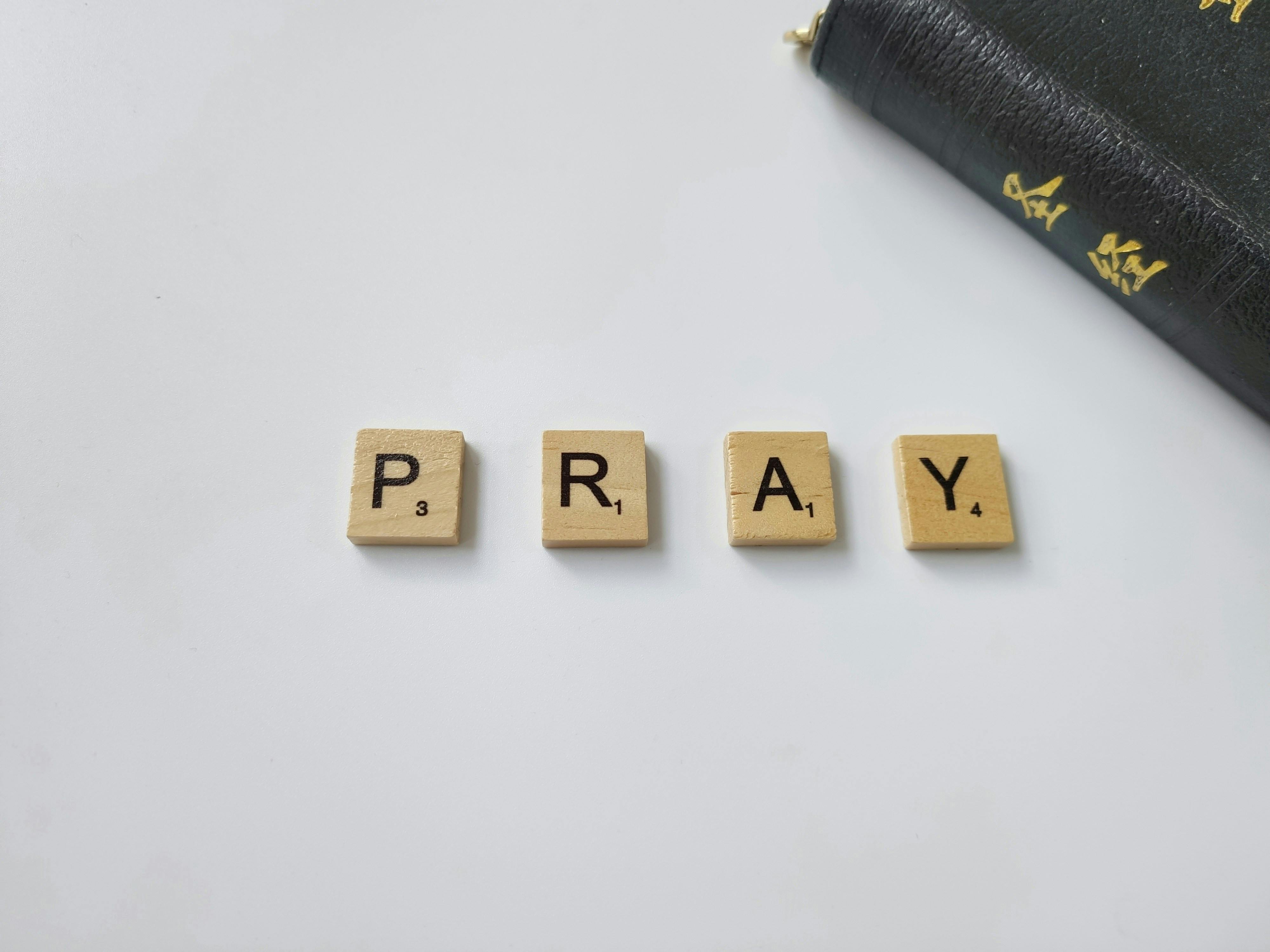 The Word "Pray" Made from Wooden Letter Tiles · Free Stock Photo