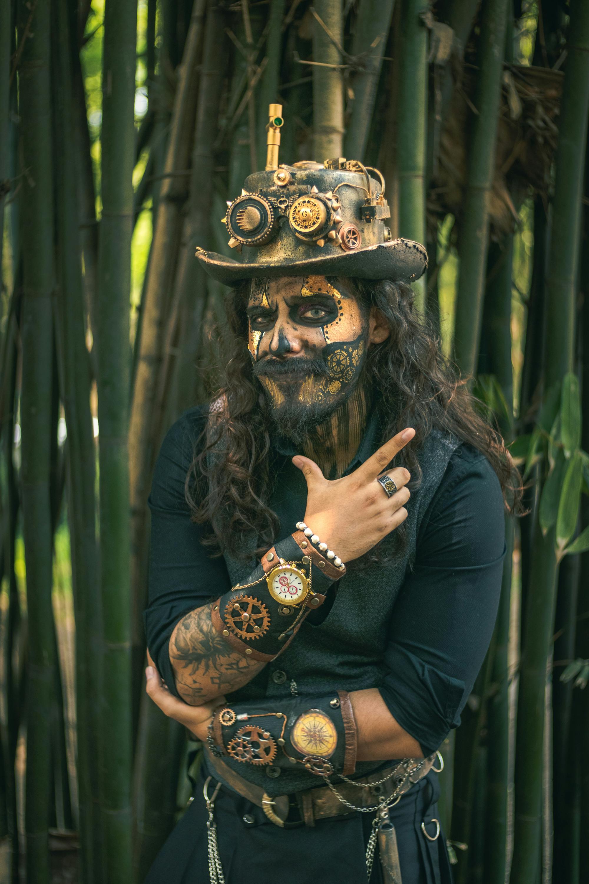 A man with tattoos and a beard is wearing a steampunk costume · Free ...