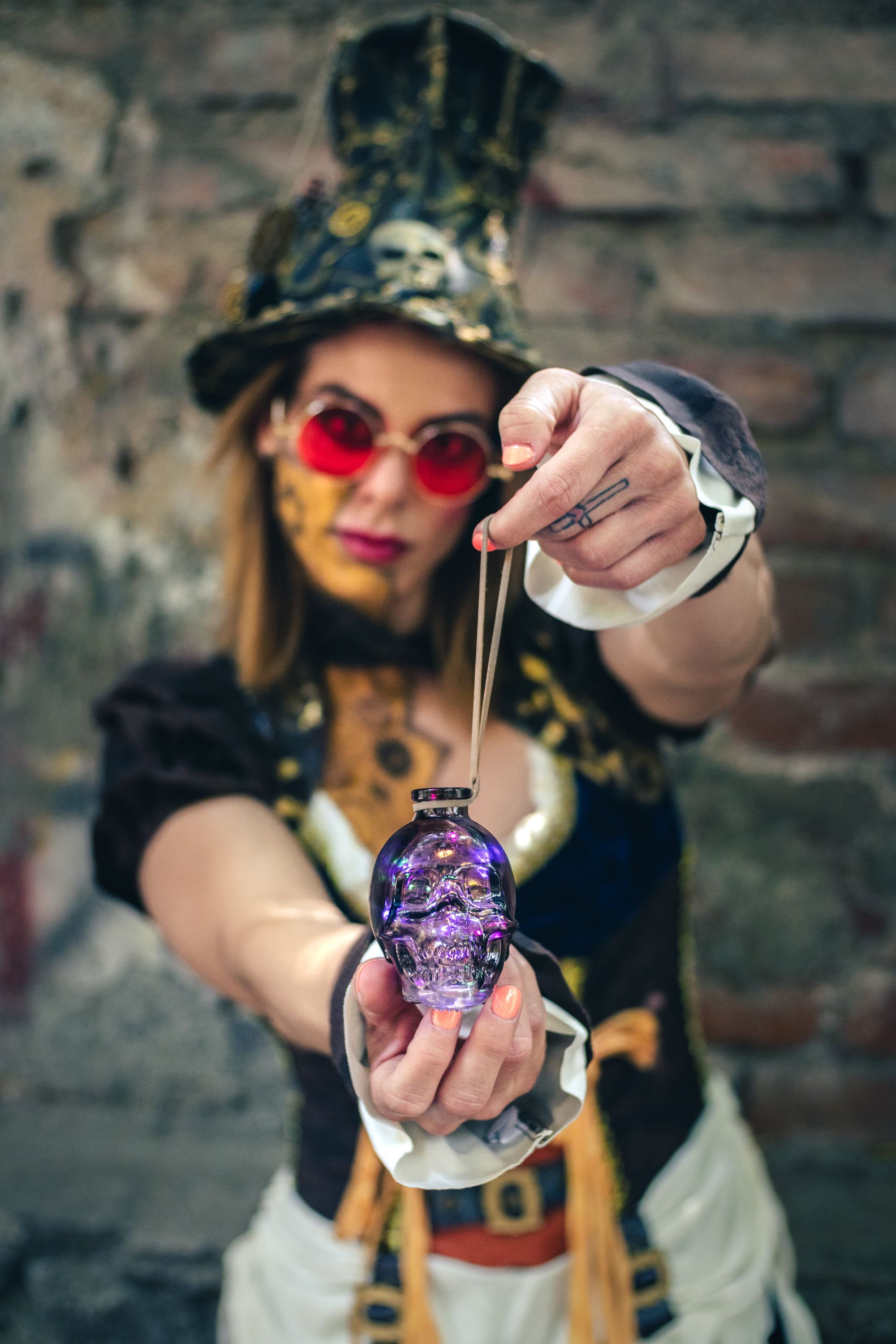 Woman in a Steampunk Costume Holding a Bottle of Perfume · Free Stock Photo