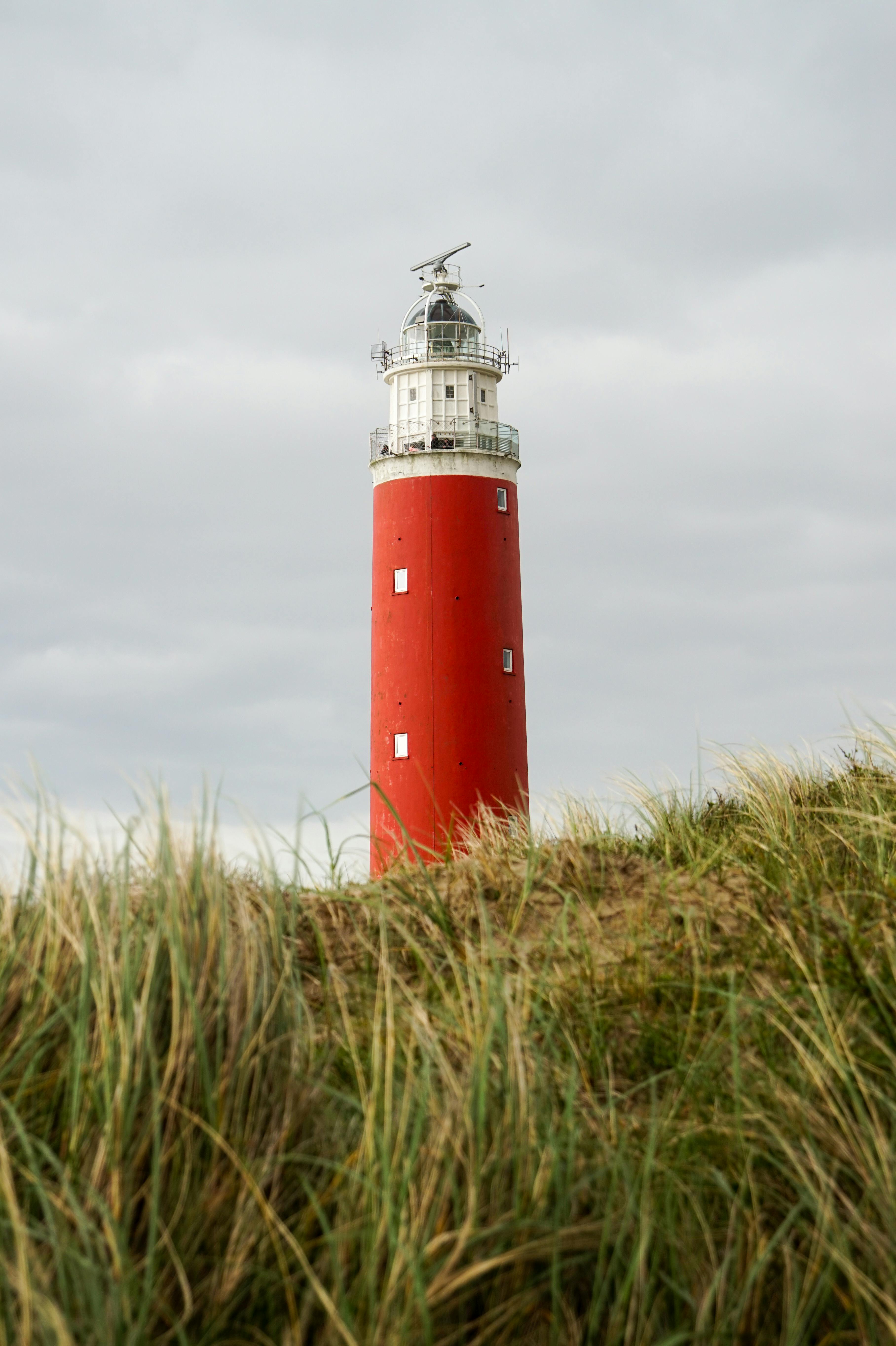 Red and White Light House on the Hill · Free Stock Photo