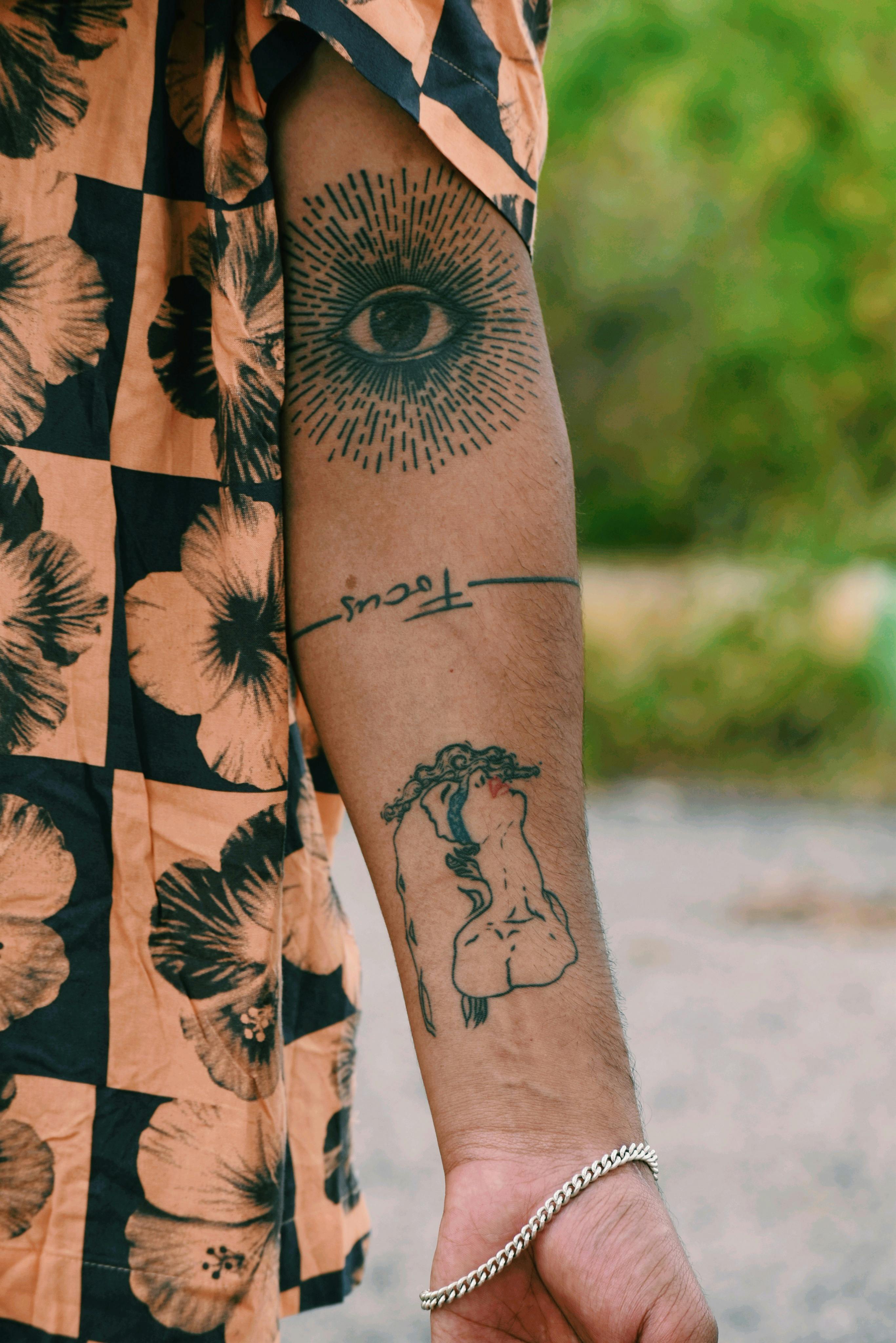 Close-up Photo of Woman's Tattooed Arm · Free Stock Photo