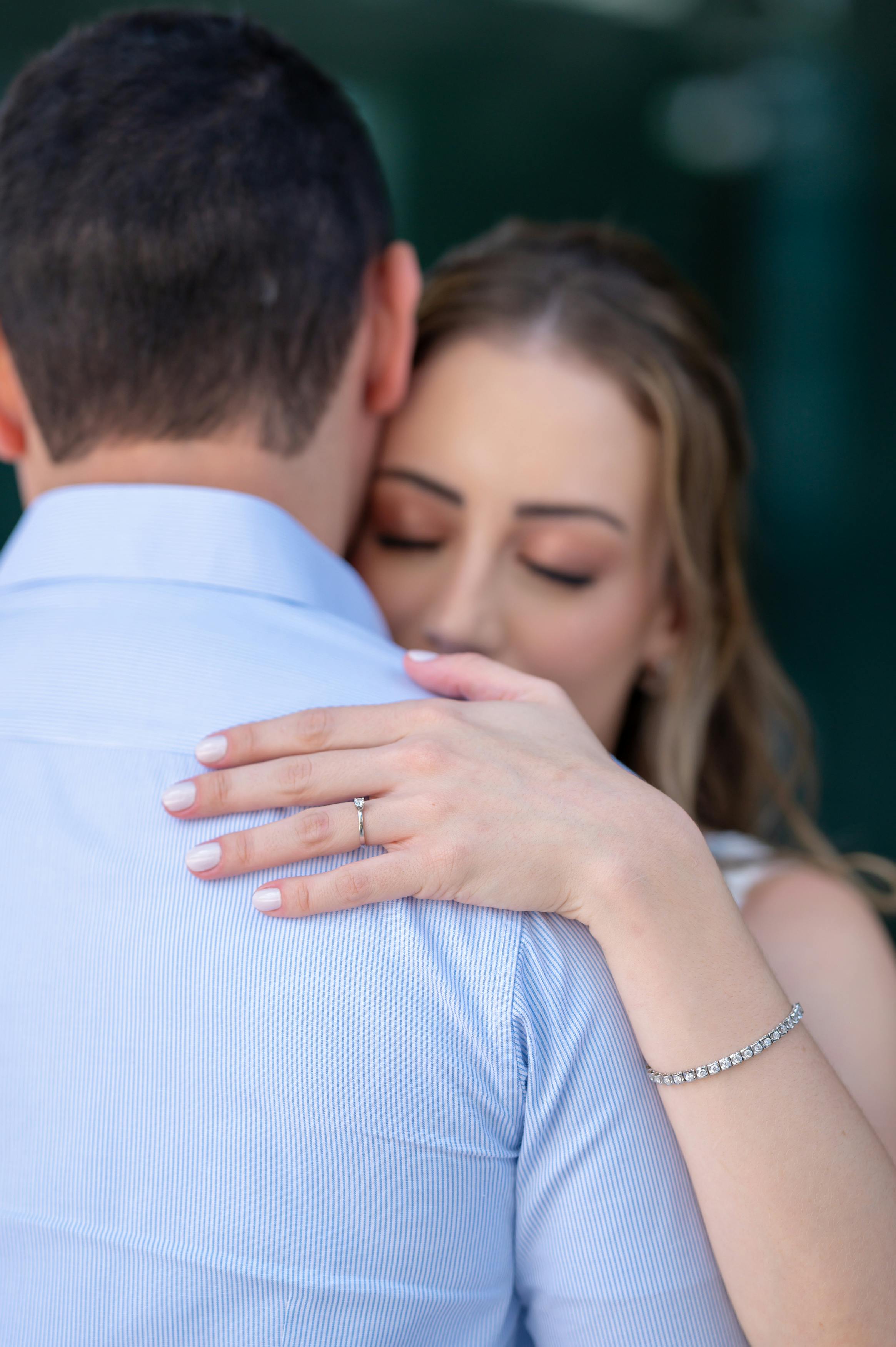 Woman Hugging Man and Holding Hand on his Shoulder · Free Stock Photo