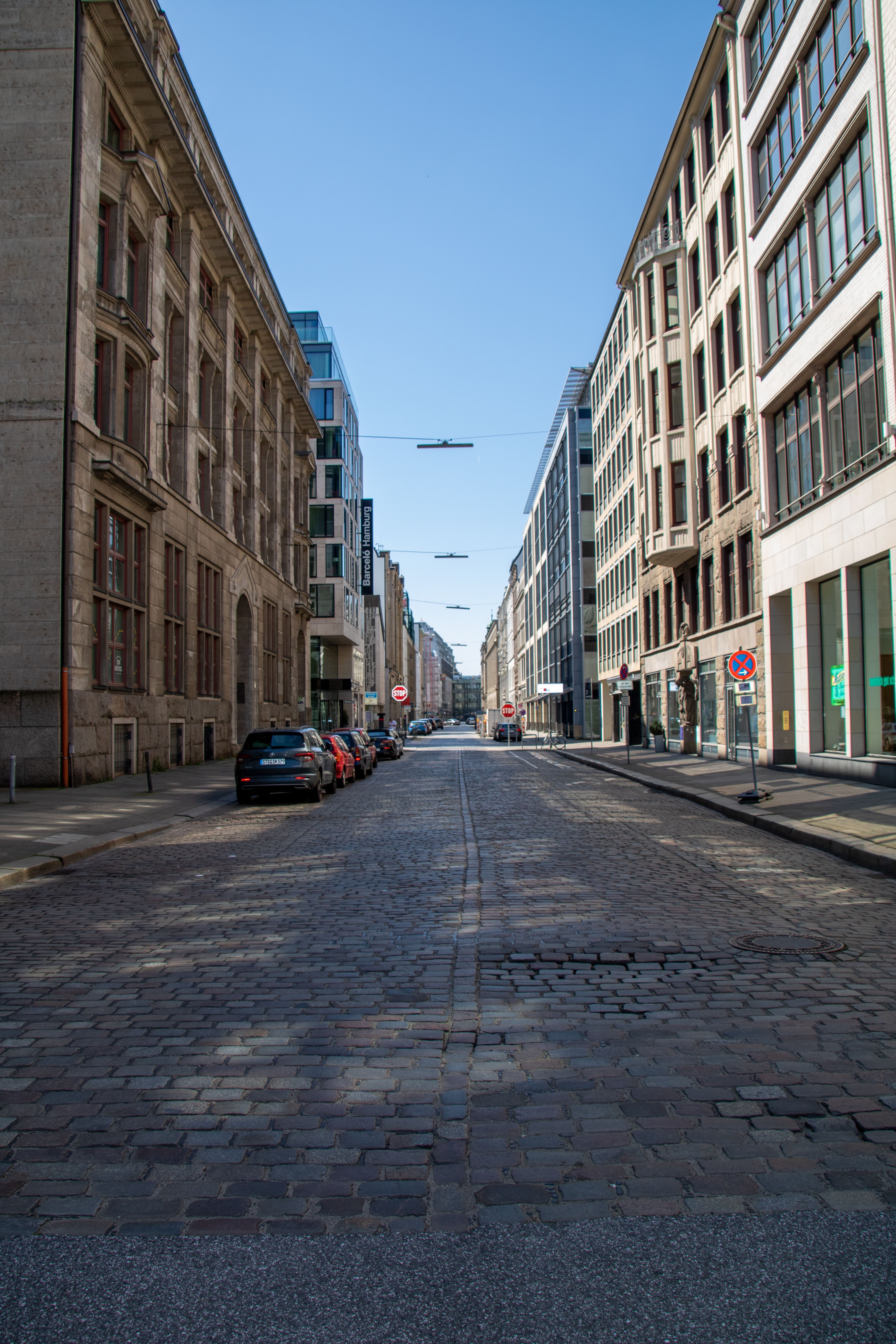 Narrow City Cobblestone Street Surrounded with Buildings · Free Stock Photo