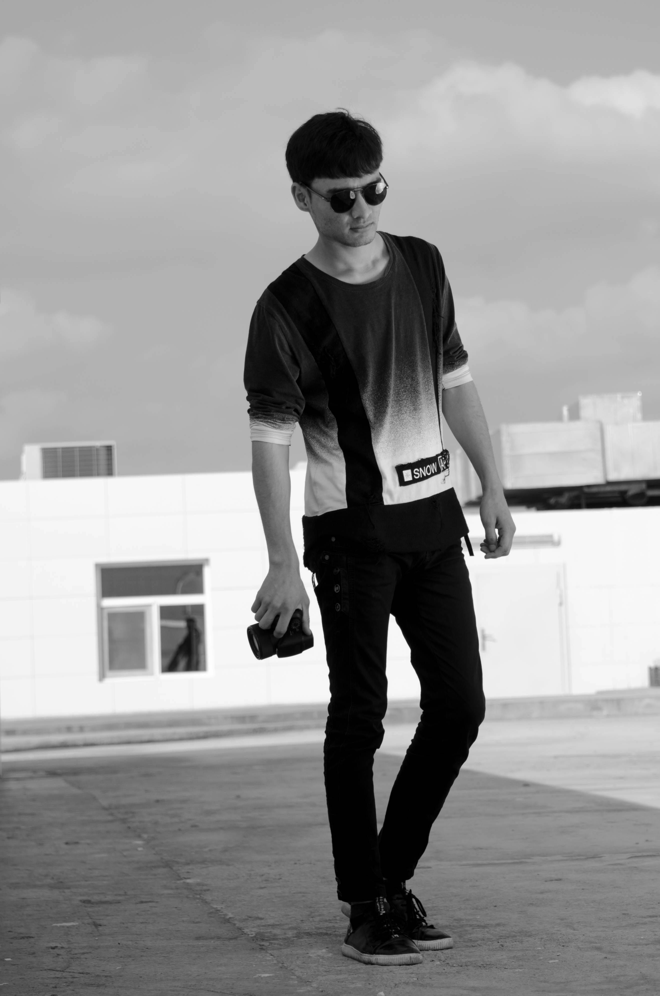 Grayscale Photo Og Man Holding Dslr Camera · Free Stock Photo