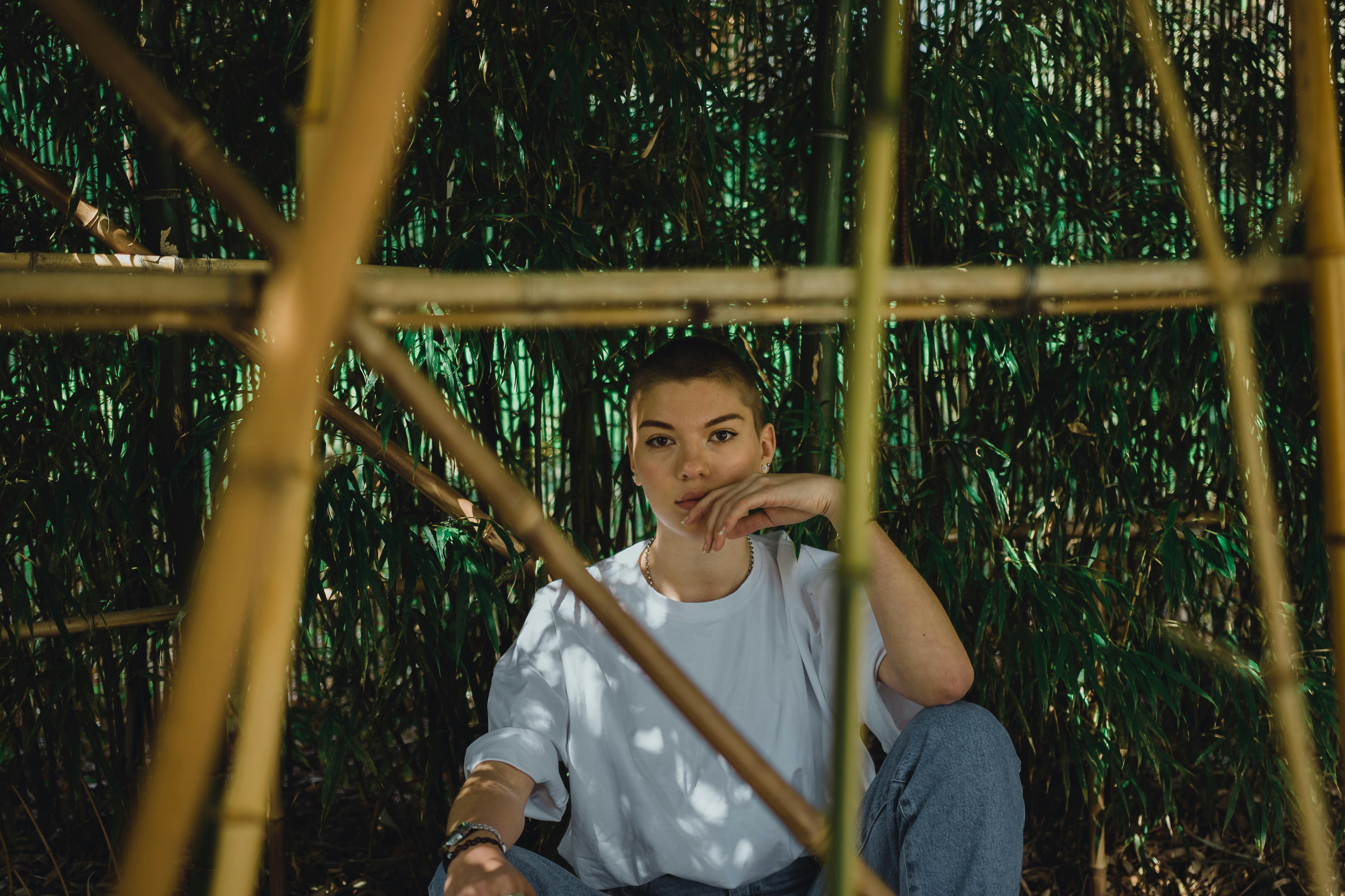 Person Sitting Beside Tree · Free Stock Photo