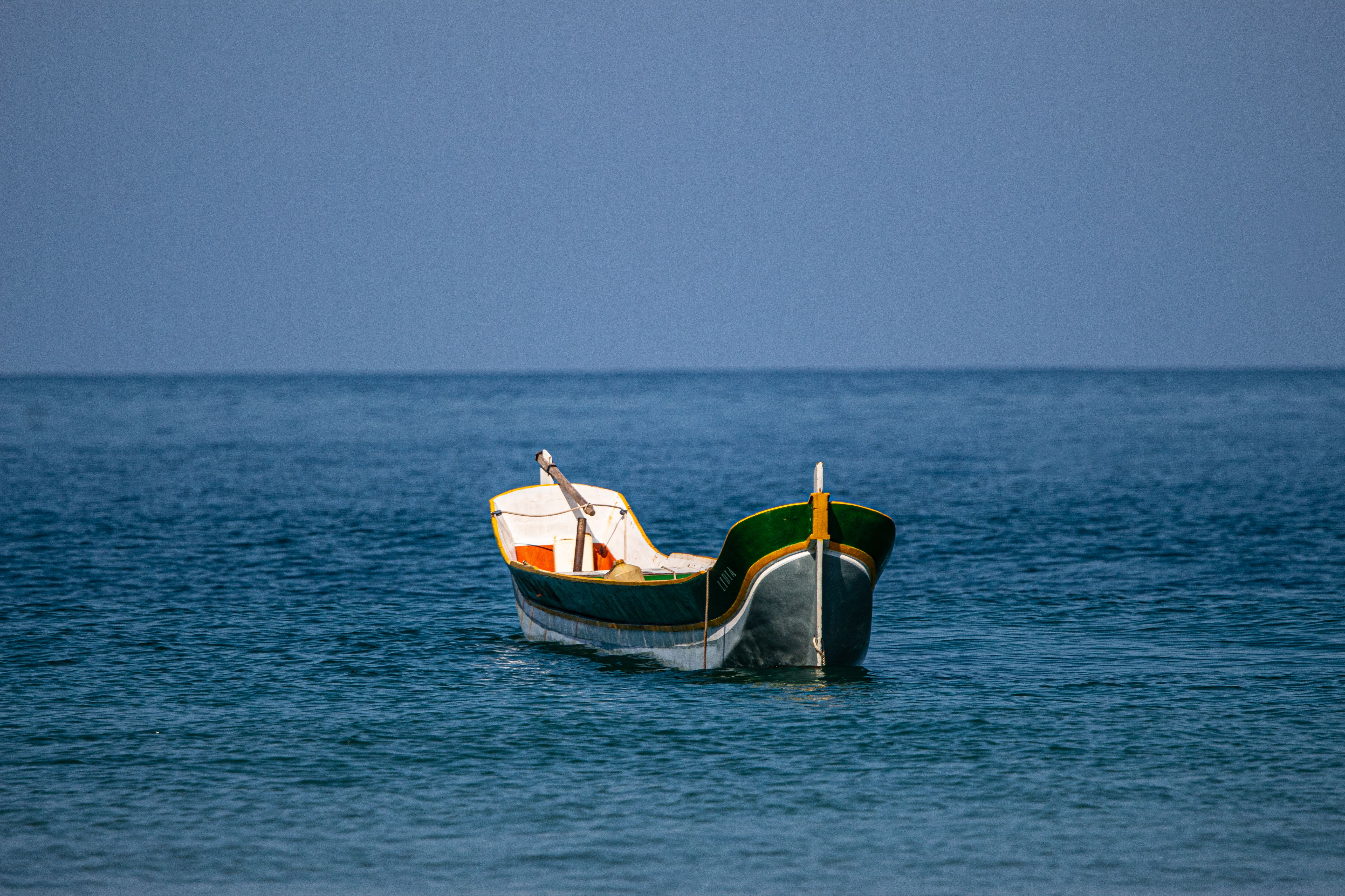 Boat in Calm Blue Sea · Free Stock Photo