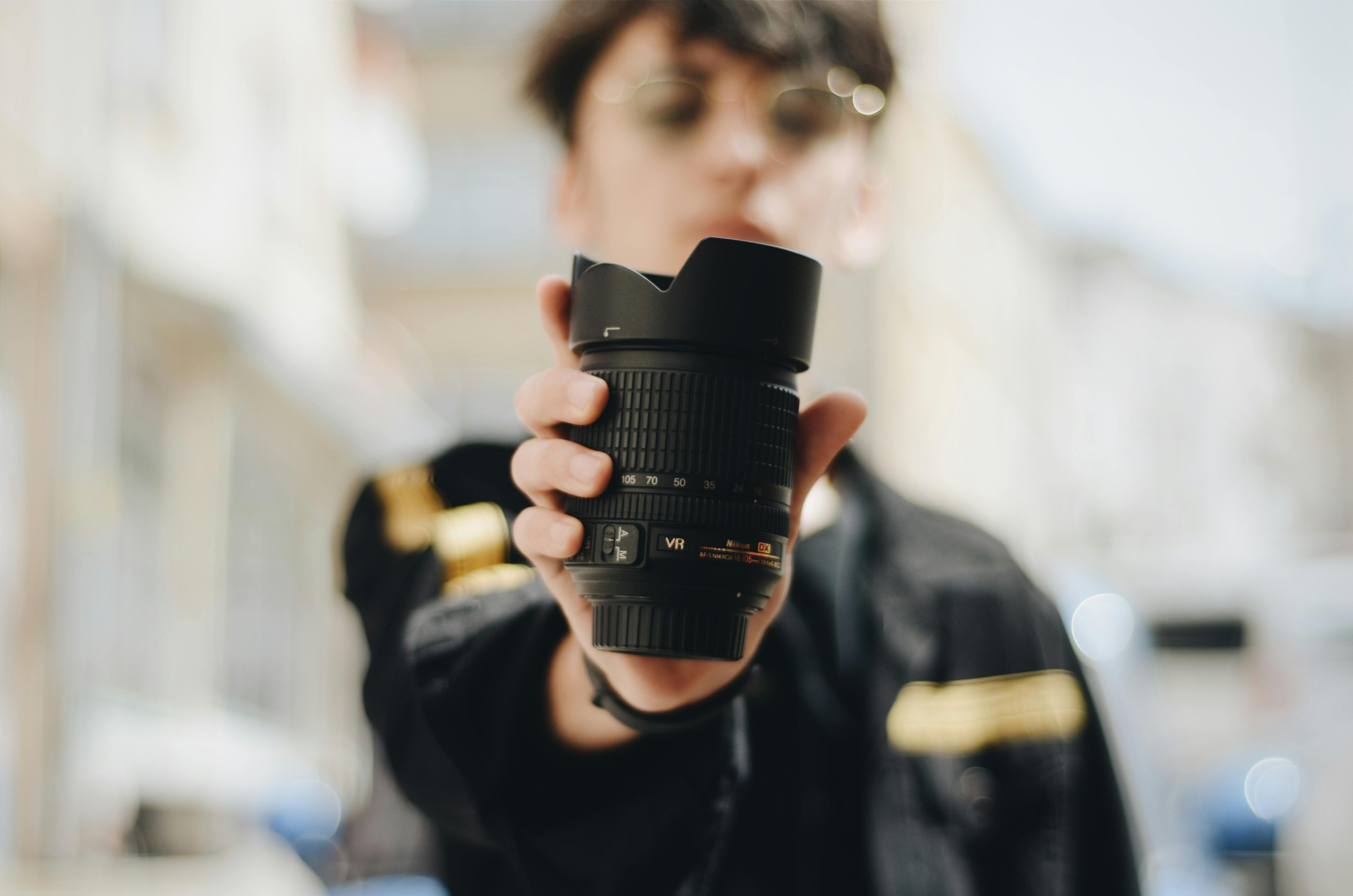 Person Holding Zoom Lens · Free Stock Photo
