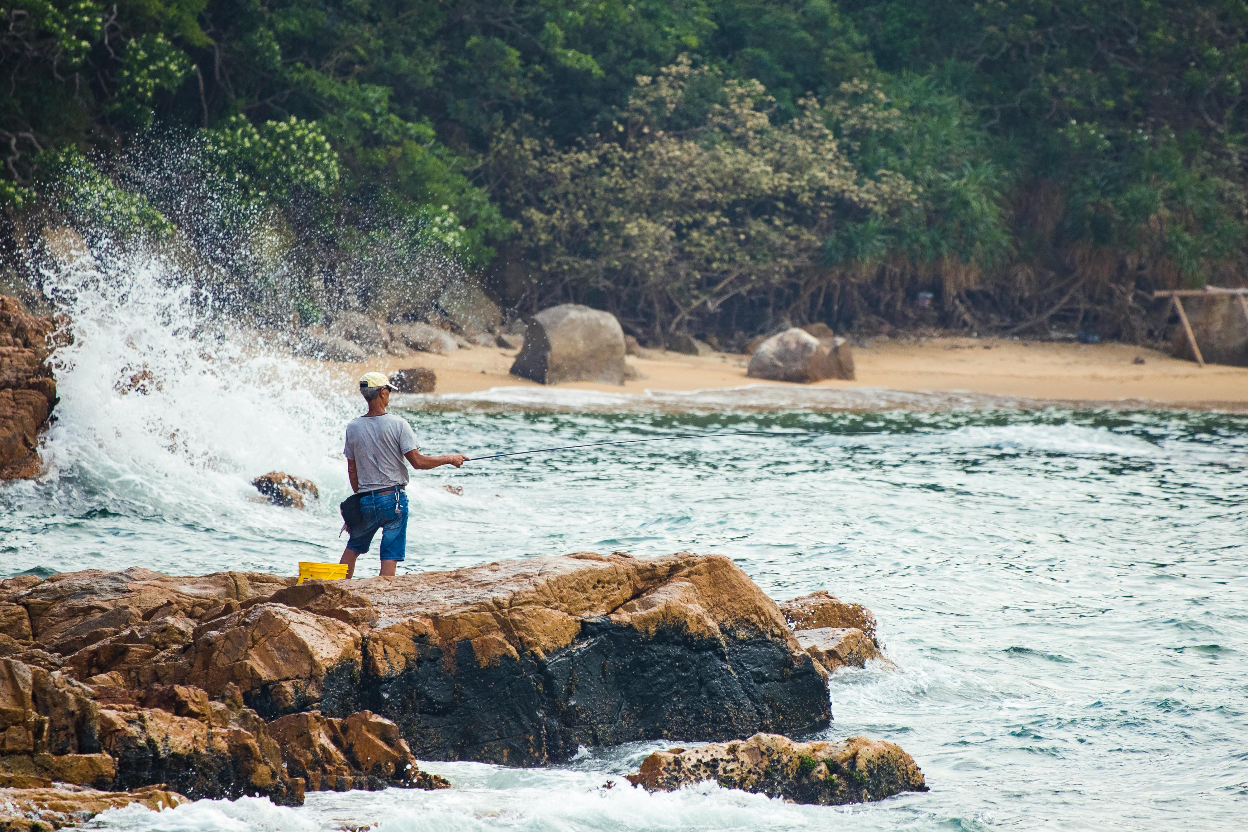 Man Standing On Rocks · Free Stock Photo