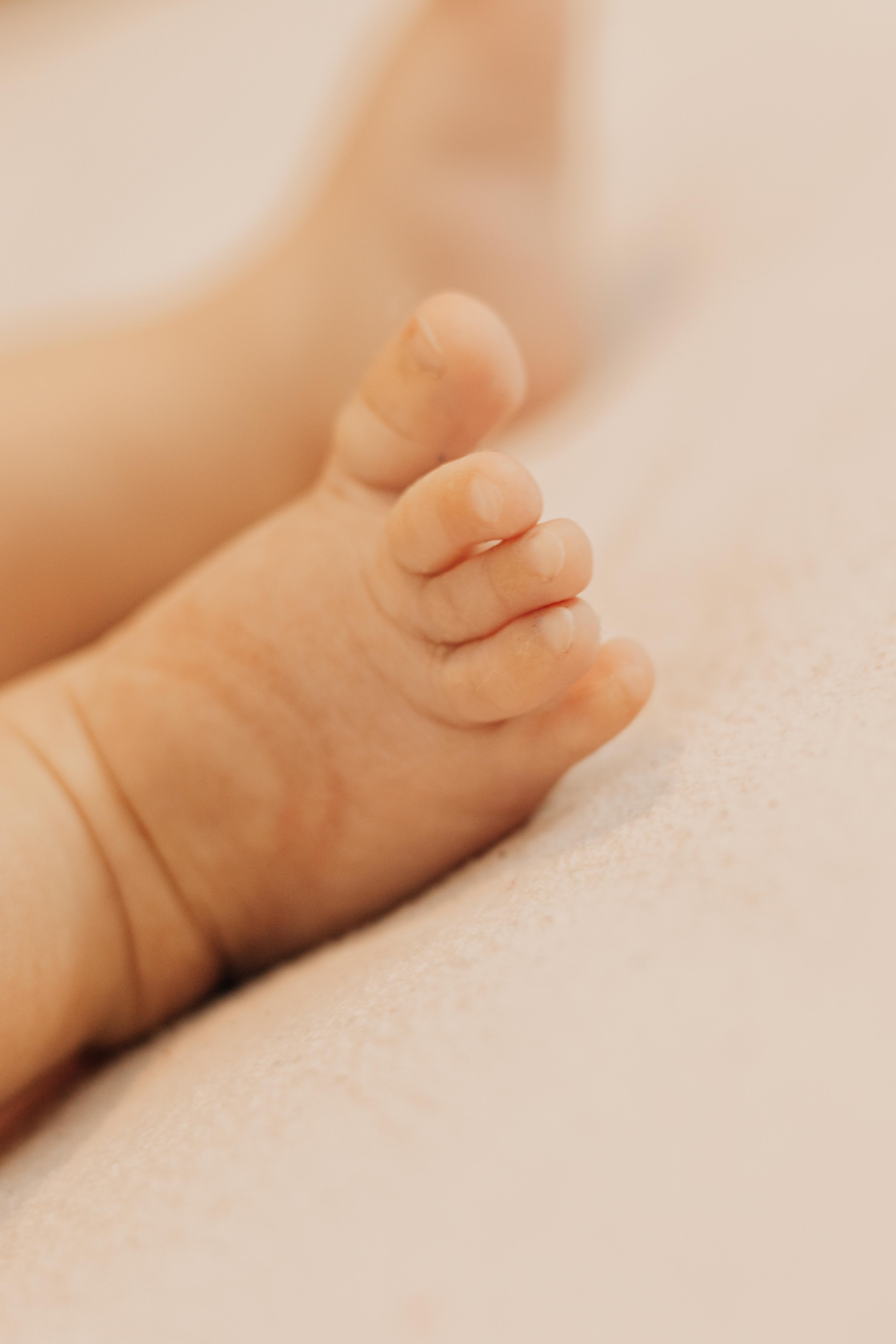 Baby's Feet on Brown Wicker Basket · Free Stock Photo