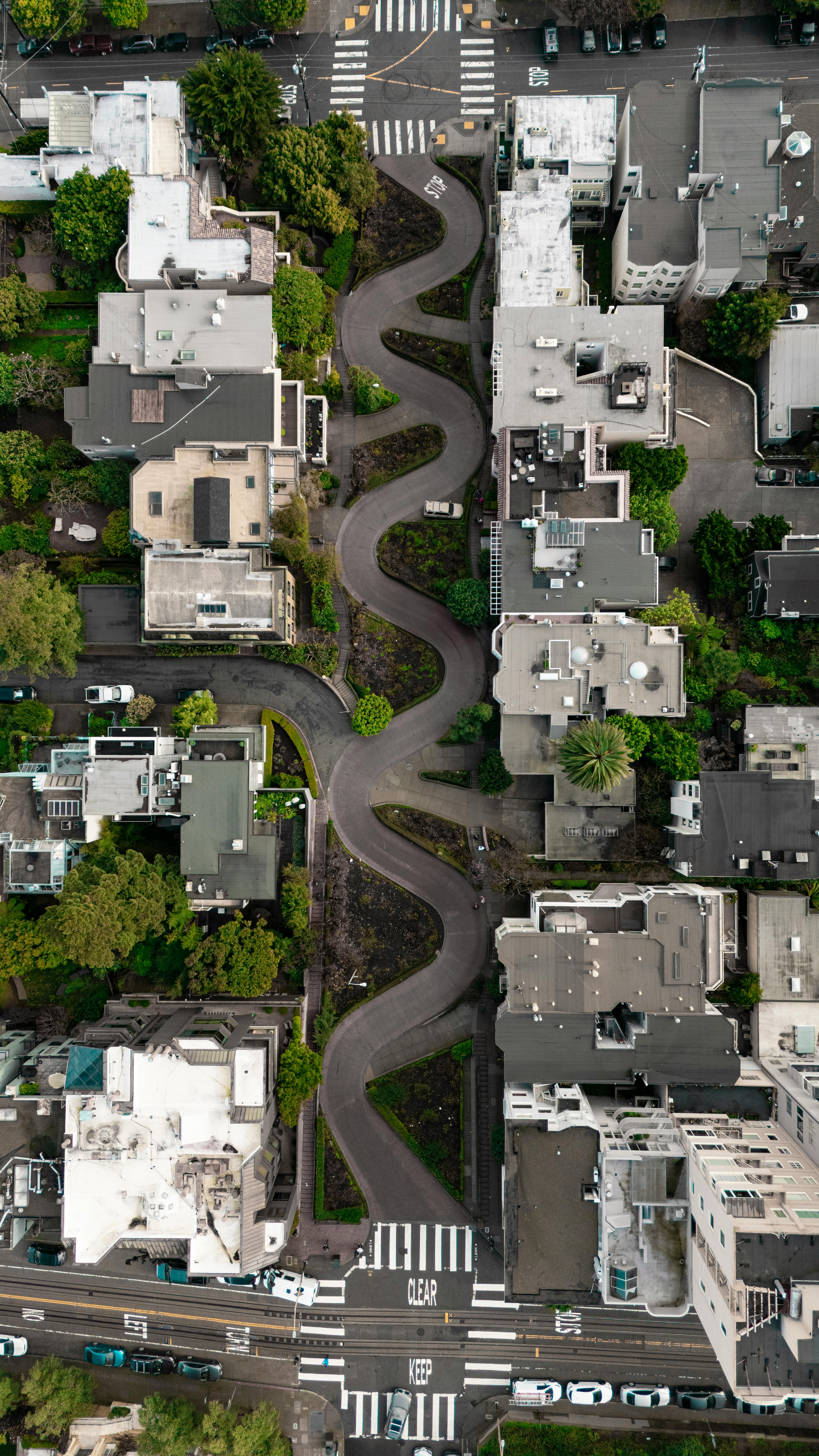Overhead View of a Winding Road Between Rows of Residential Buildings ...