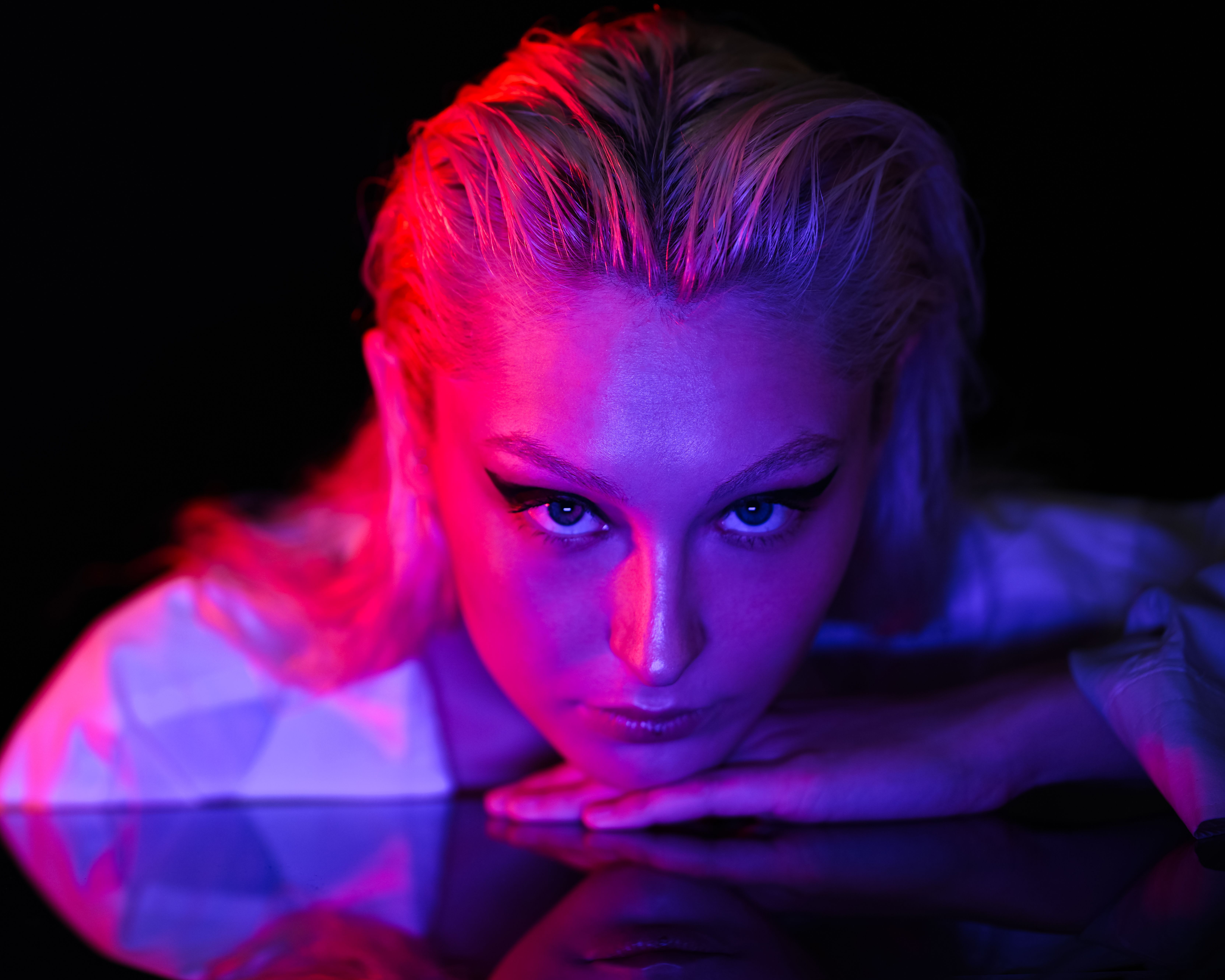 Studio Shot of a Young Woman Posing in Split Lighting · Free Stock Photo