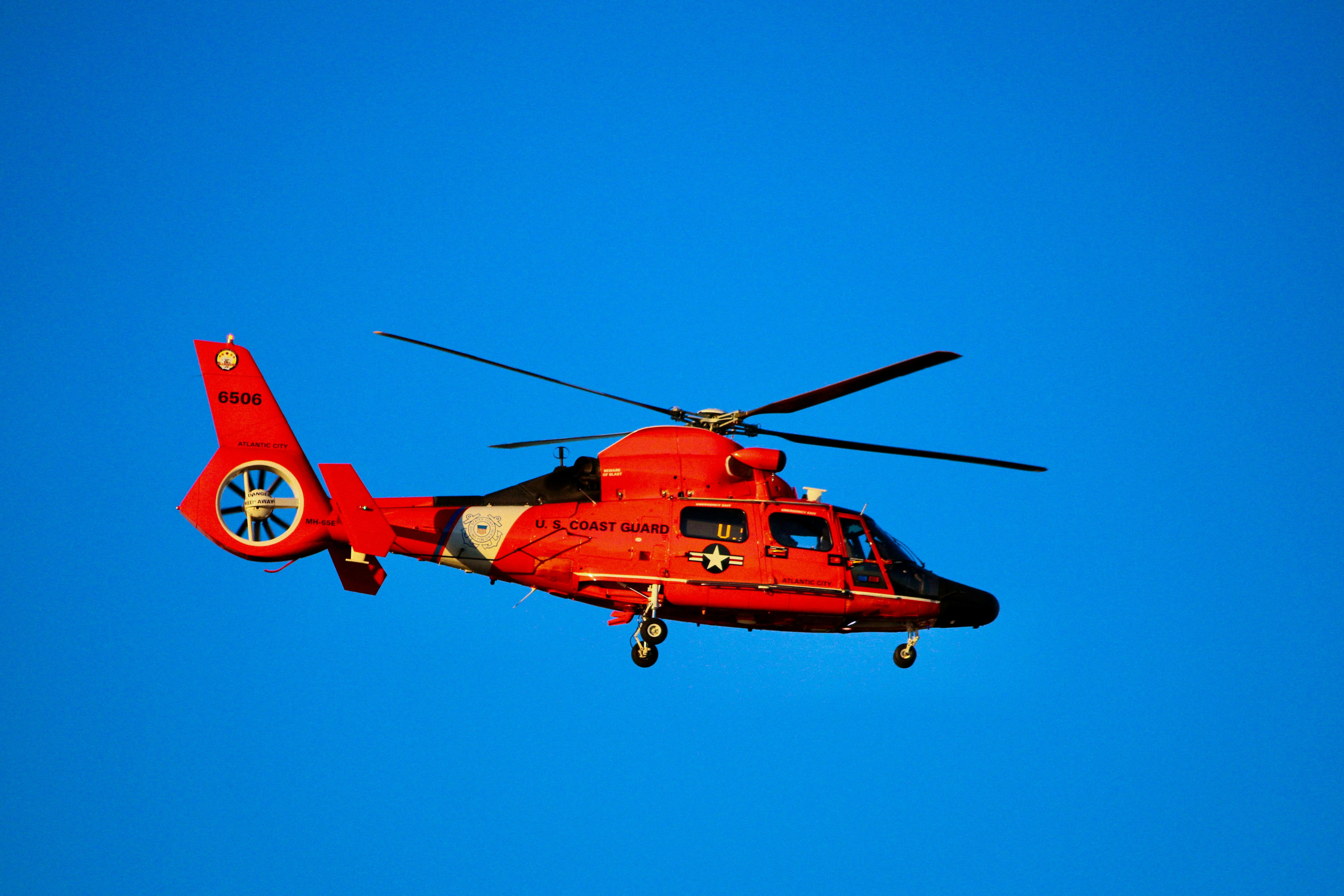 Helicopter Flying Over Body Of Water · Free Stock Photo