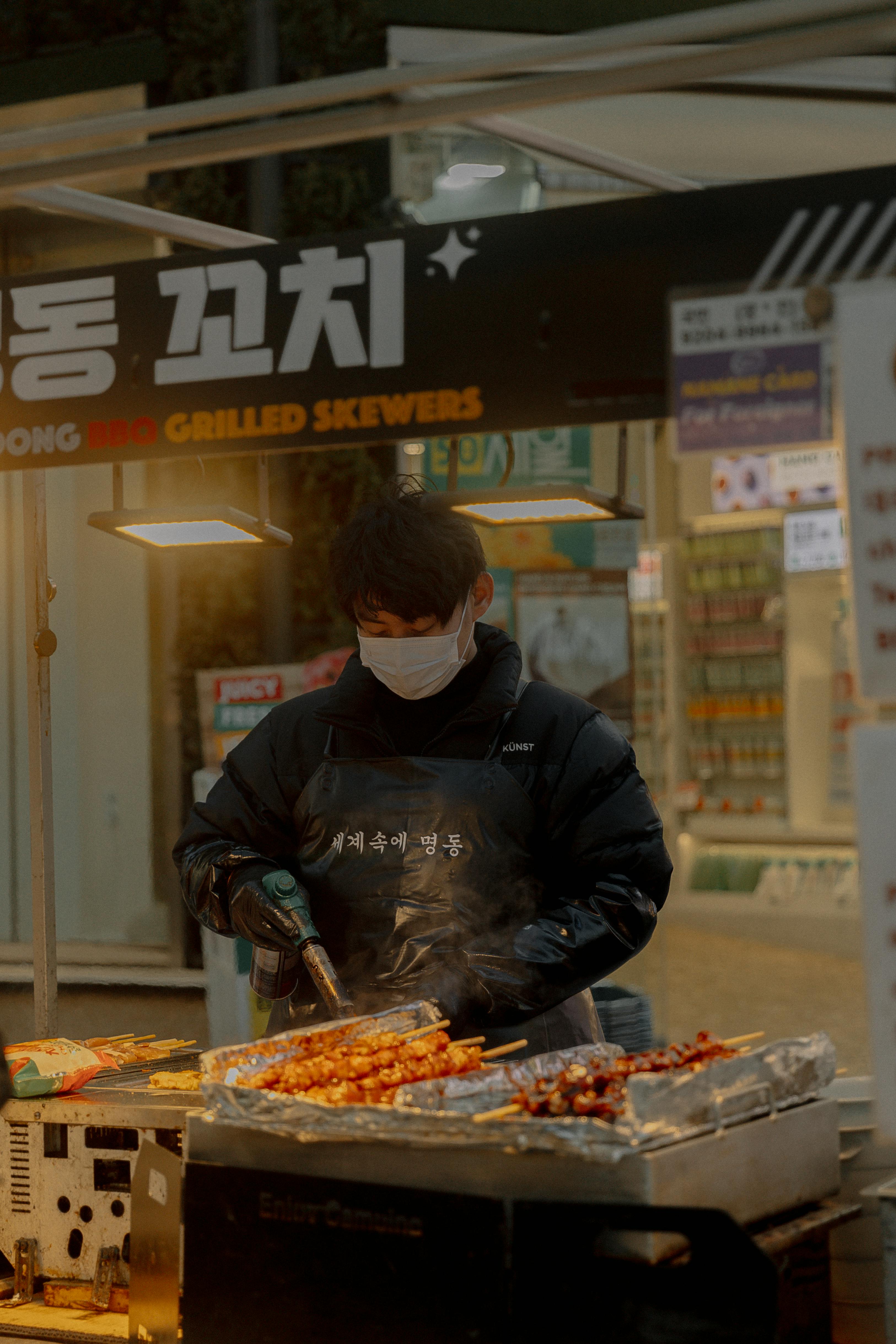 Man Cooking at Food Stand · Free Stock Photo